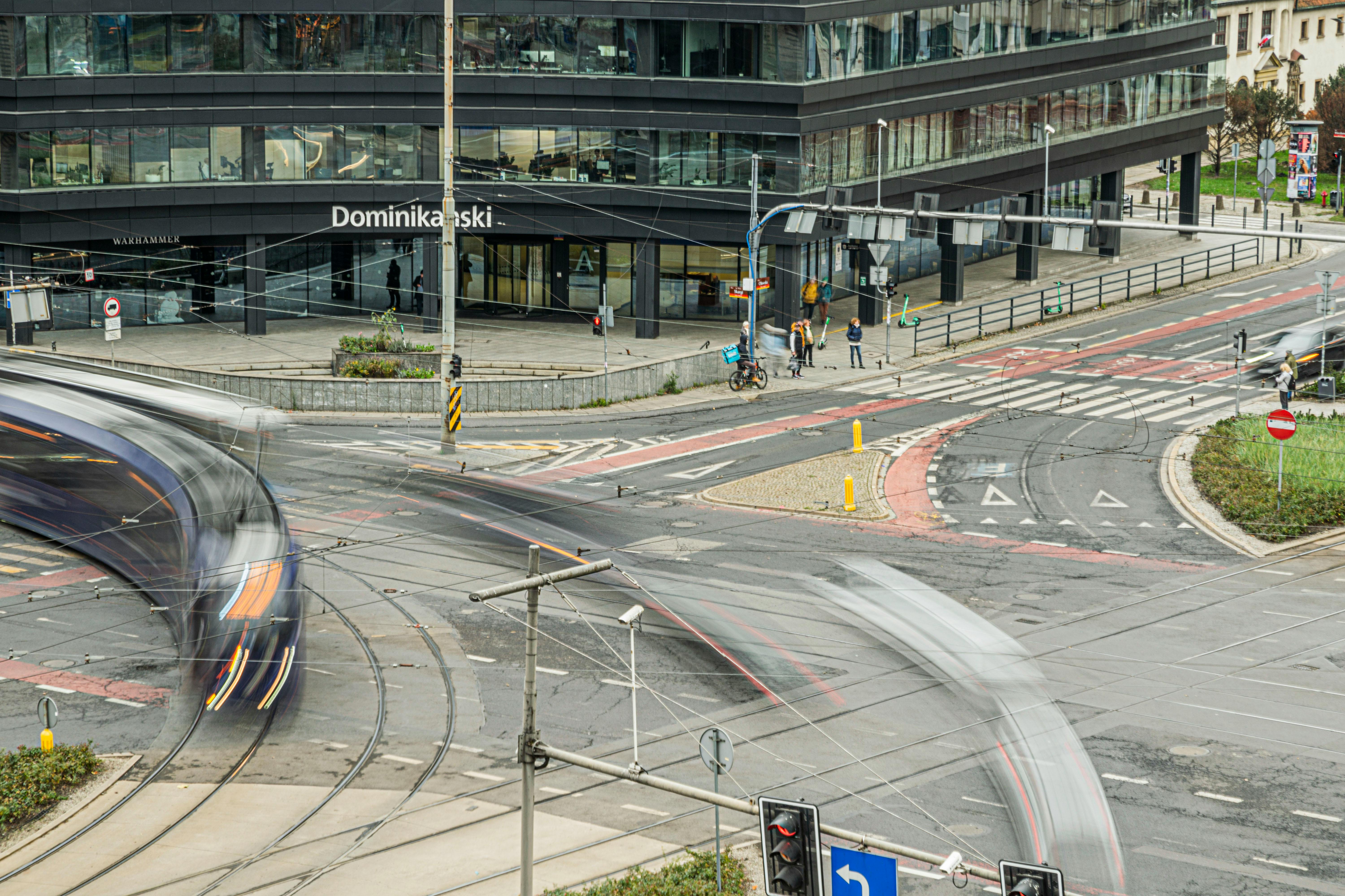Dynamic Urban Intersection with Modern Architecture · Free Stock Photo