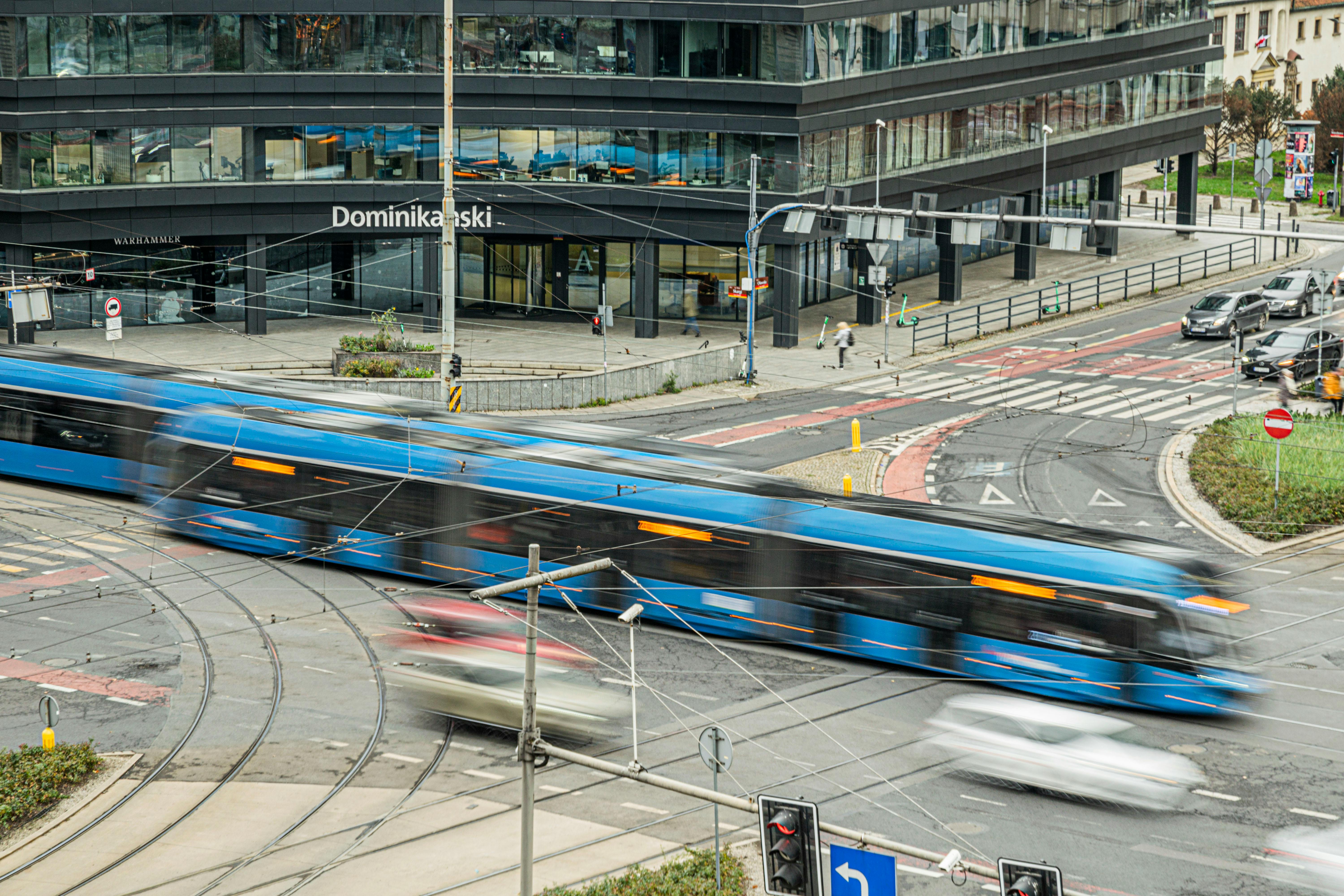 Modern City Intersection with Blurred Tram Motion · Free Stock Photo