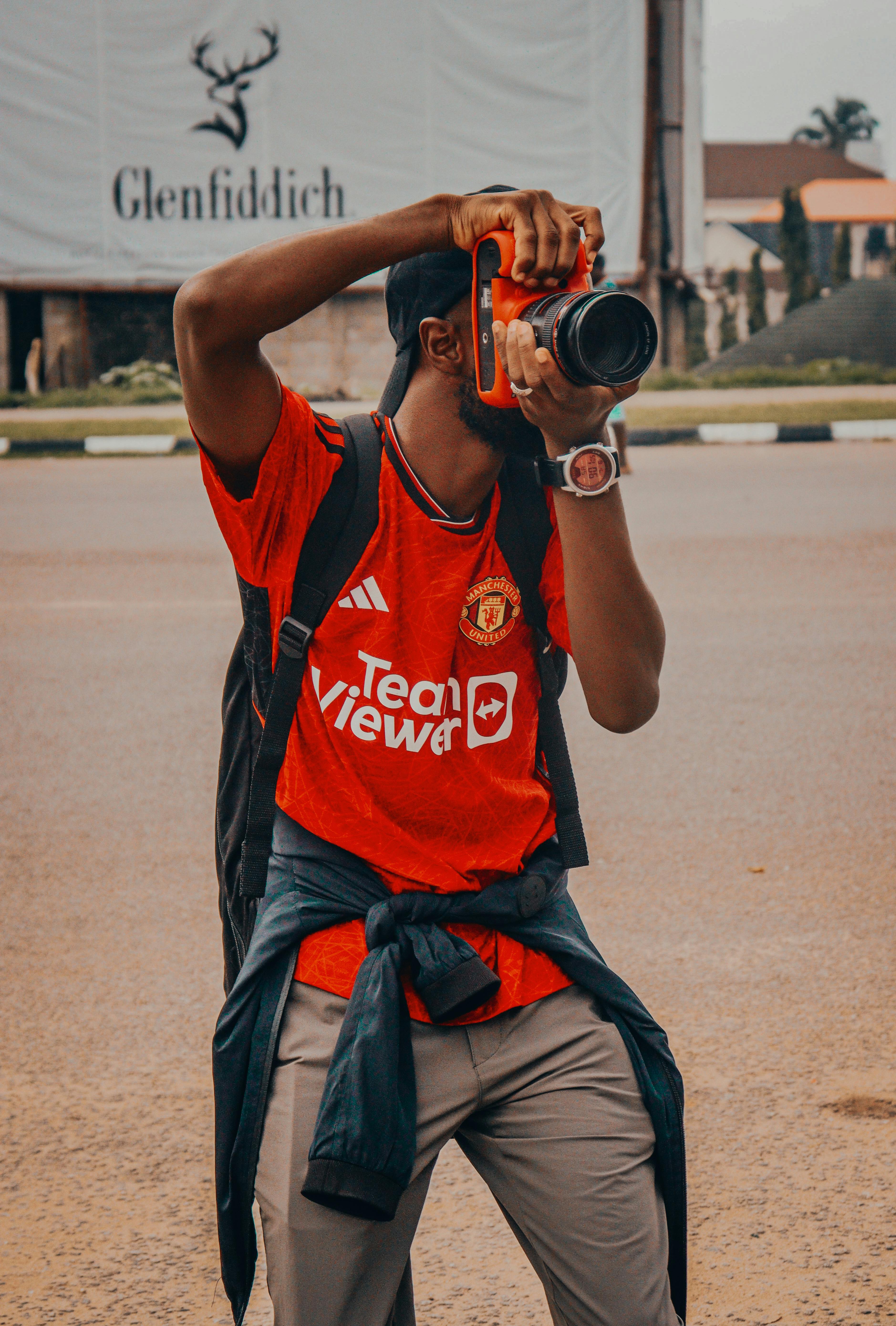 Young Photographer Capturing Urban Street Scene · Free Stock Photo