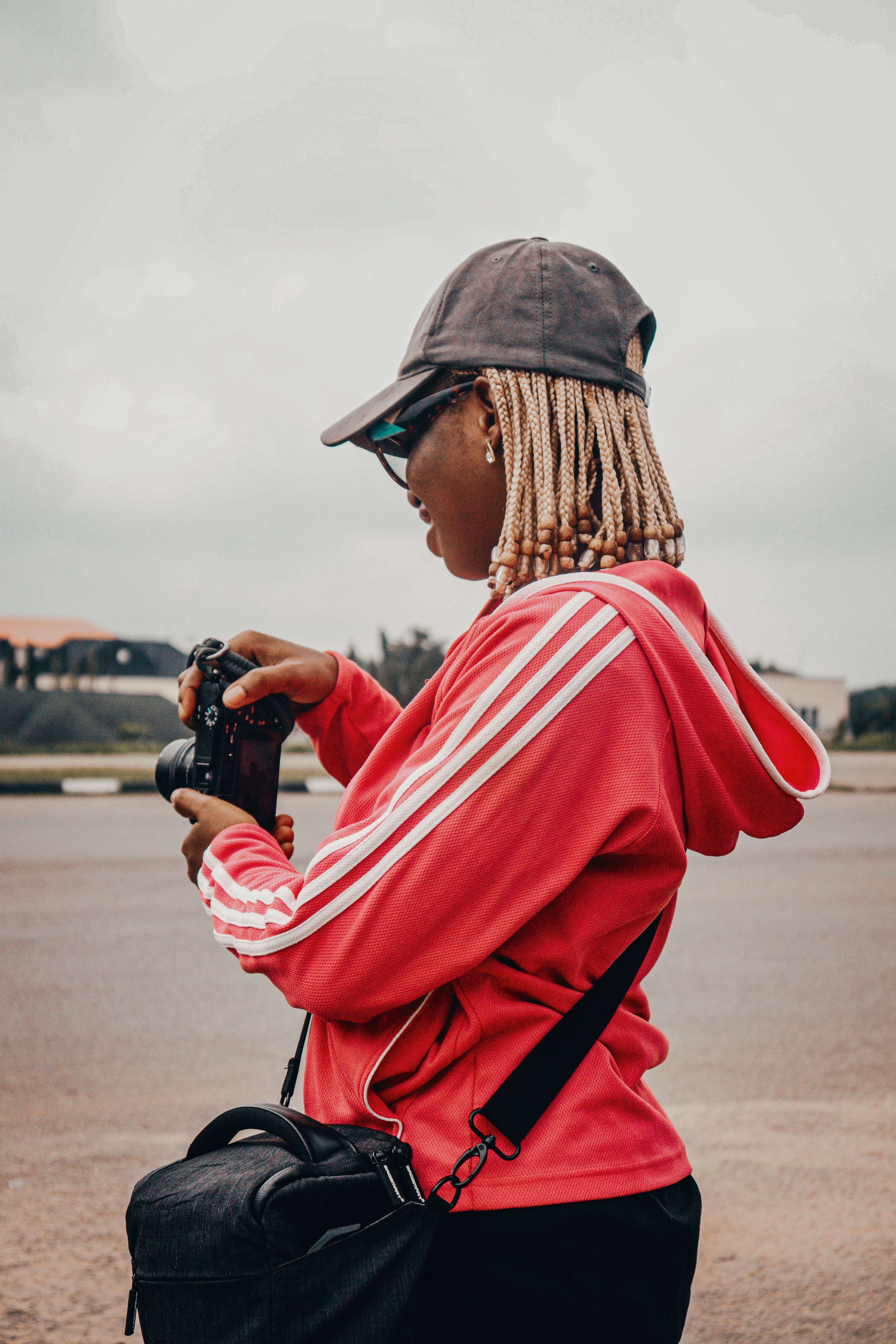 Female Photographer Outdoors with Camera · Free Stock Photo