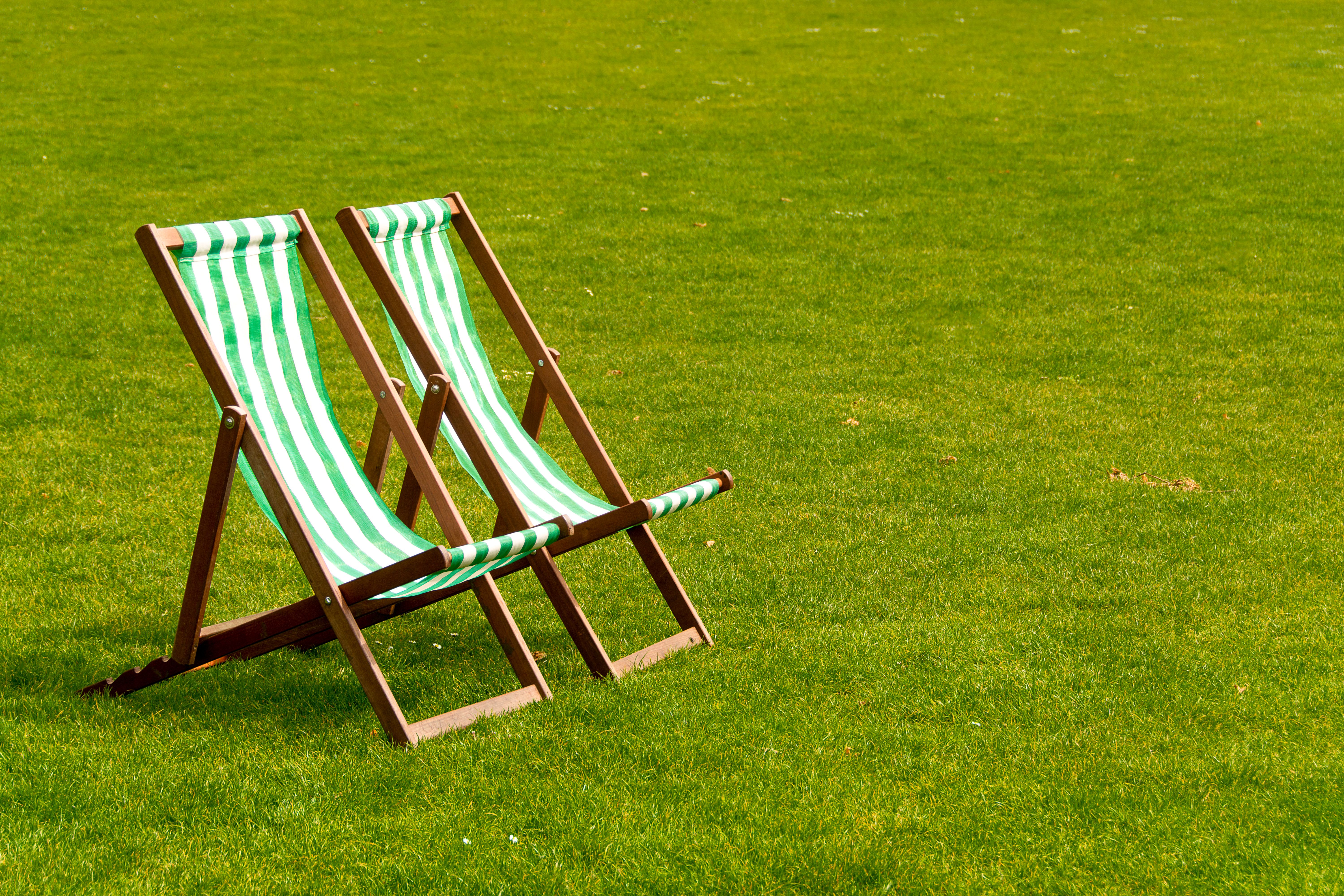 Two Deck Chairs on Green Grass Outdoors · Free Stock Photo