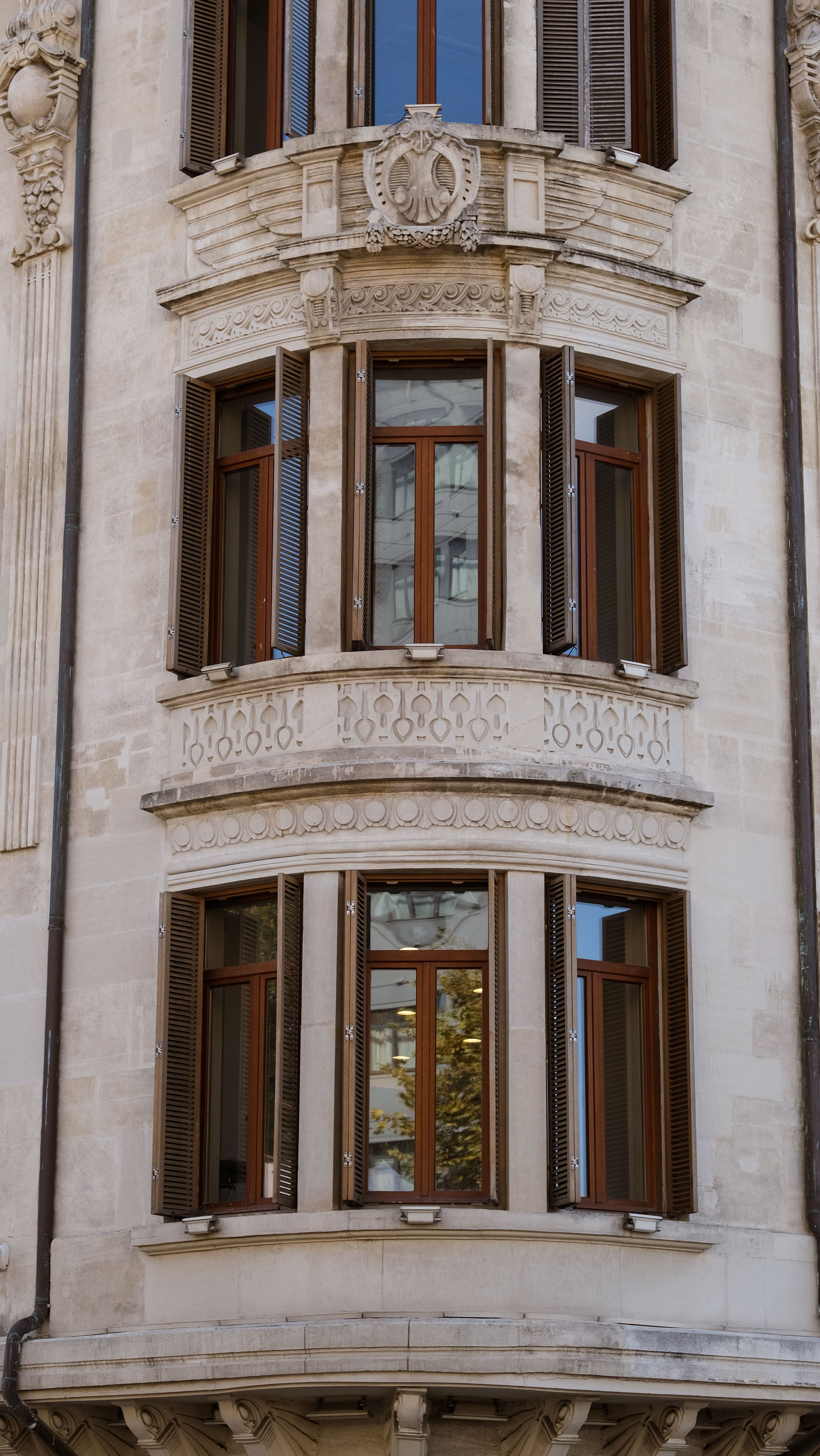 Elegant Historic Building Facade with Large Windows · Free Stock Photo