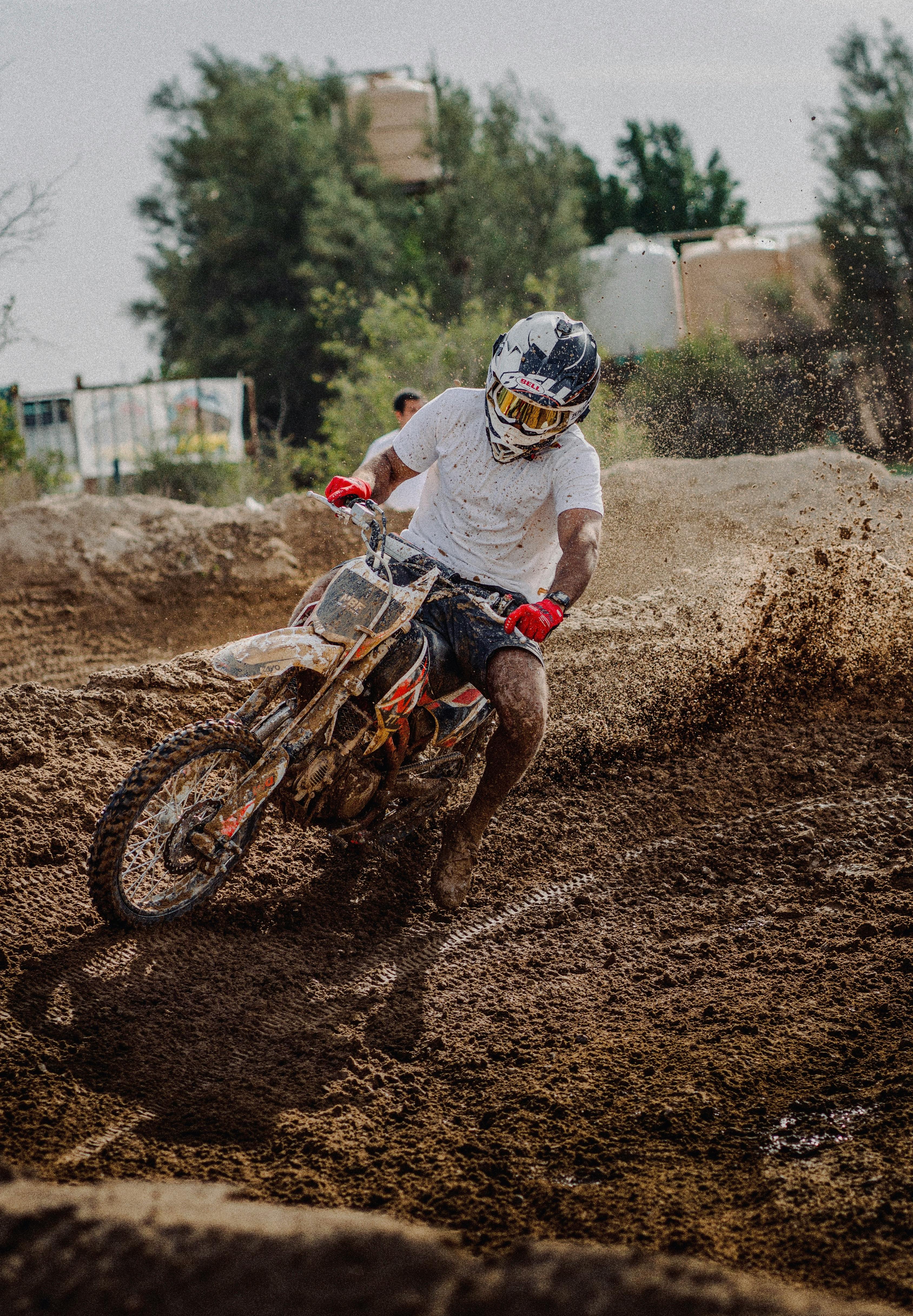 Dynamic Off-Road Motorcycle Racing Action Shot · Free Stock Photo