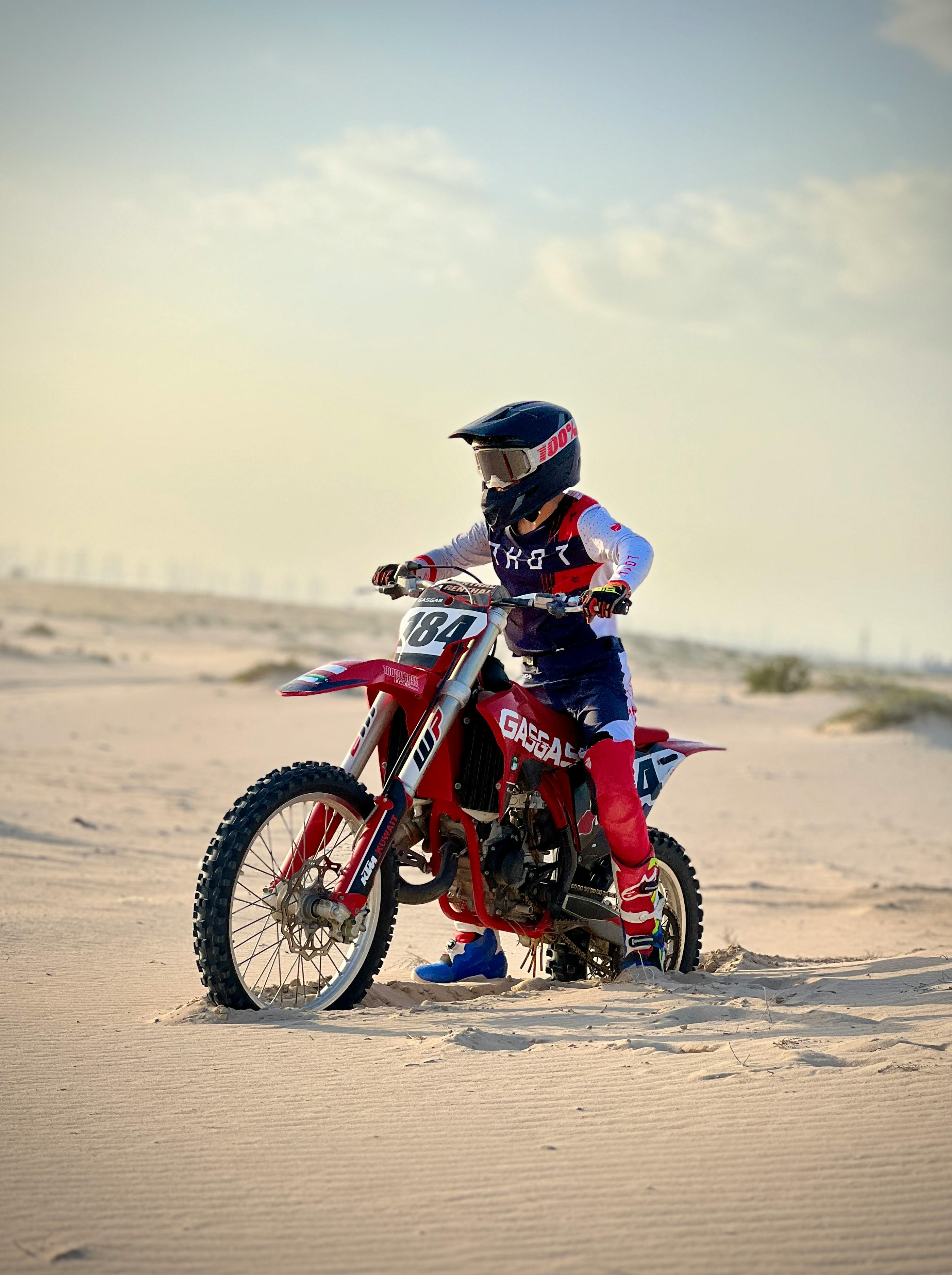 Child Motocross Rider on Desert Dunes · Free Stock Photo