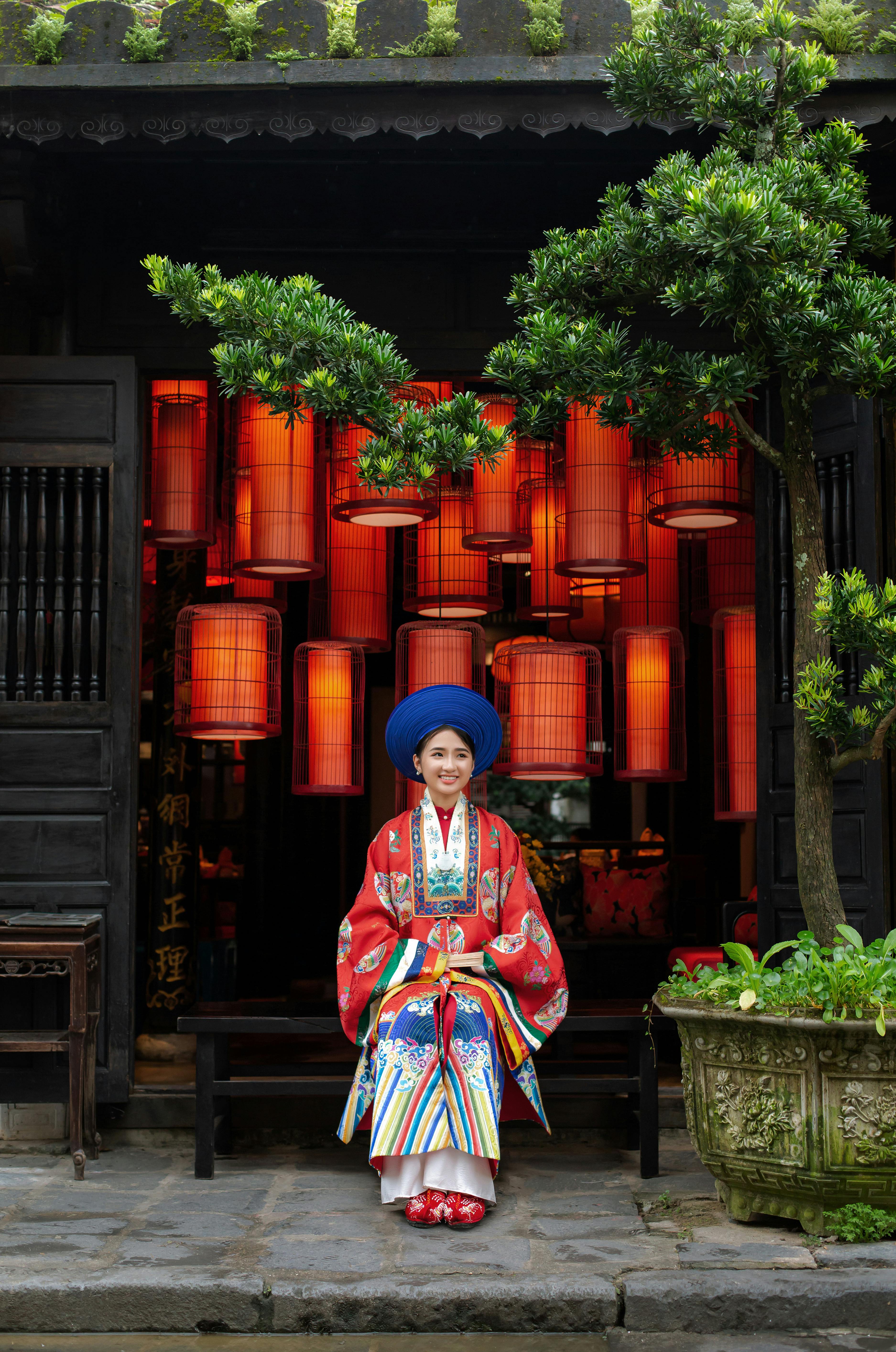 Traditional Asian Attire in Vibrant Cultural Setting · Free Stock Photo