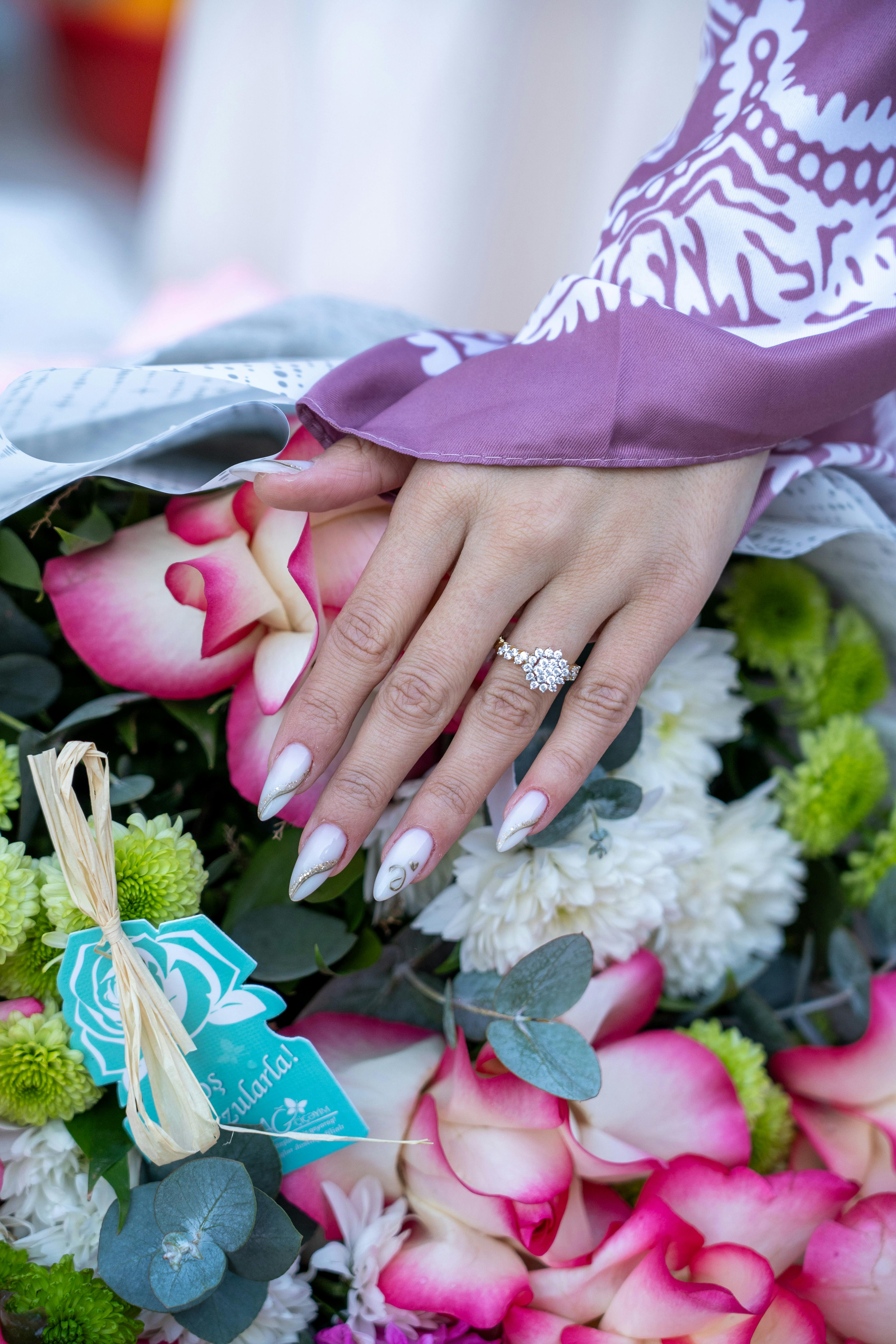 Elegant Hand with Floral Bouquet in Paris · Free Stock Photo