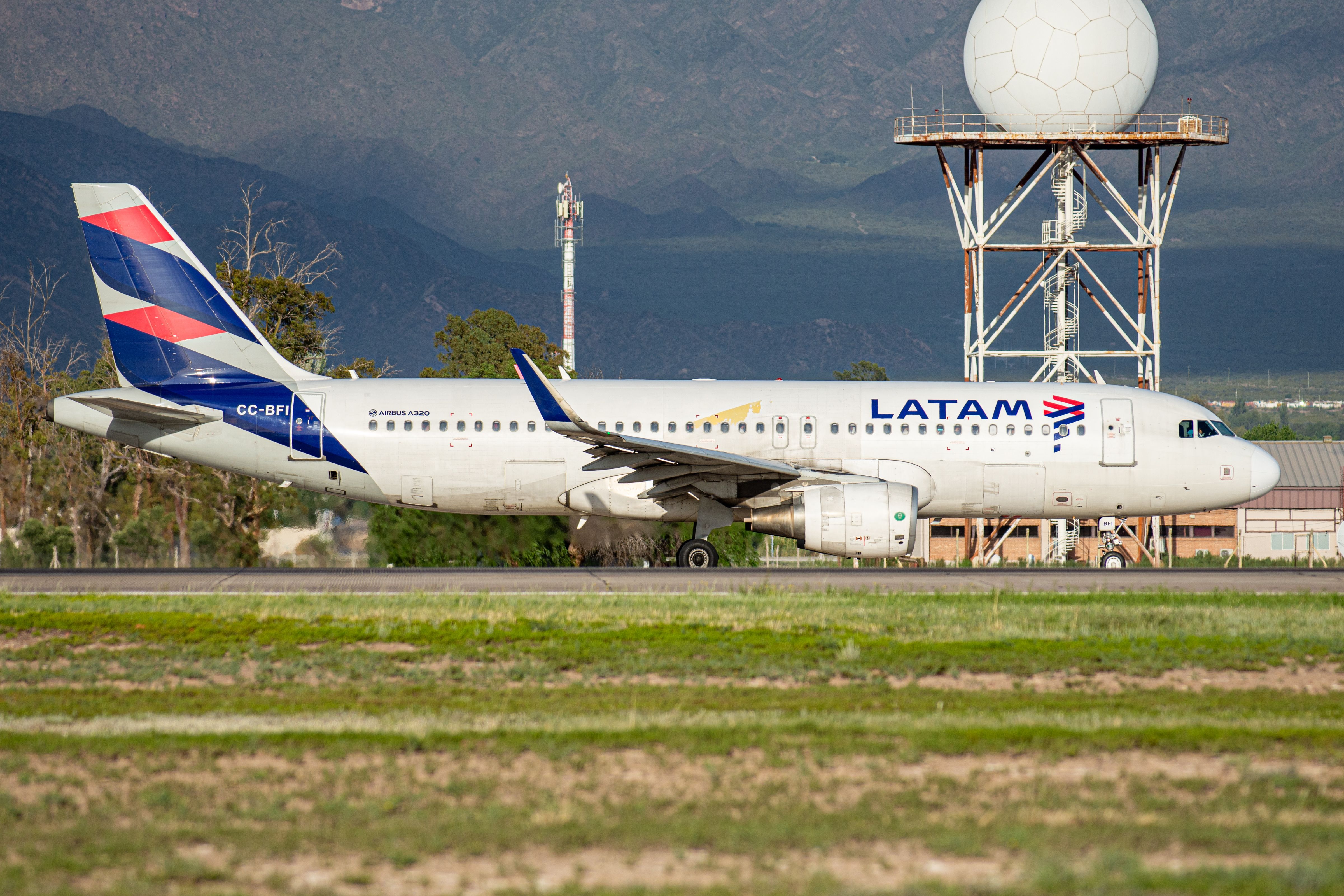 LATAM Airbus A320 on Tarmac with Radar Tower · Free Stock Photo