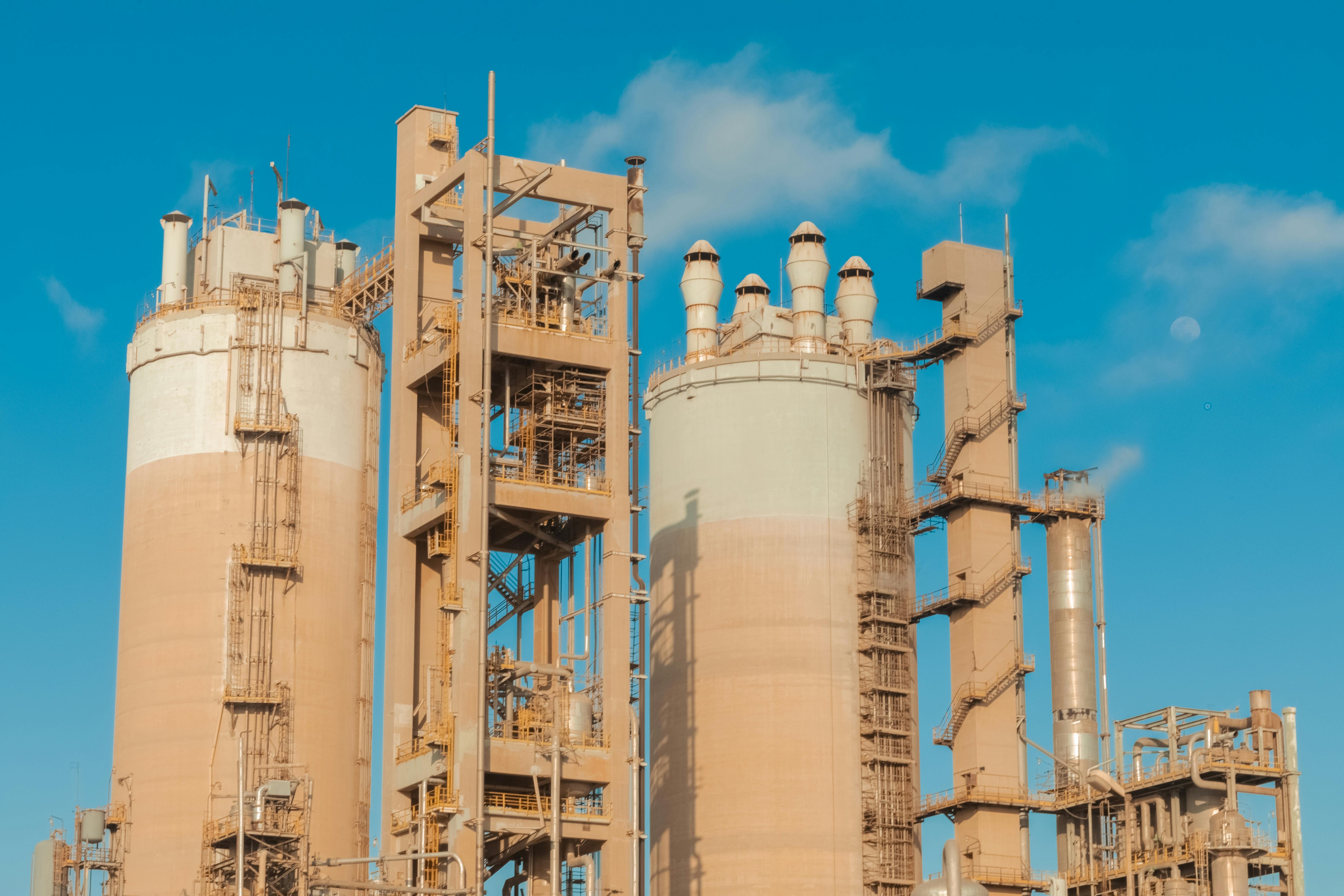 Industrial Urea Towers Against Blue Sky in Libya · Free Stock Photo