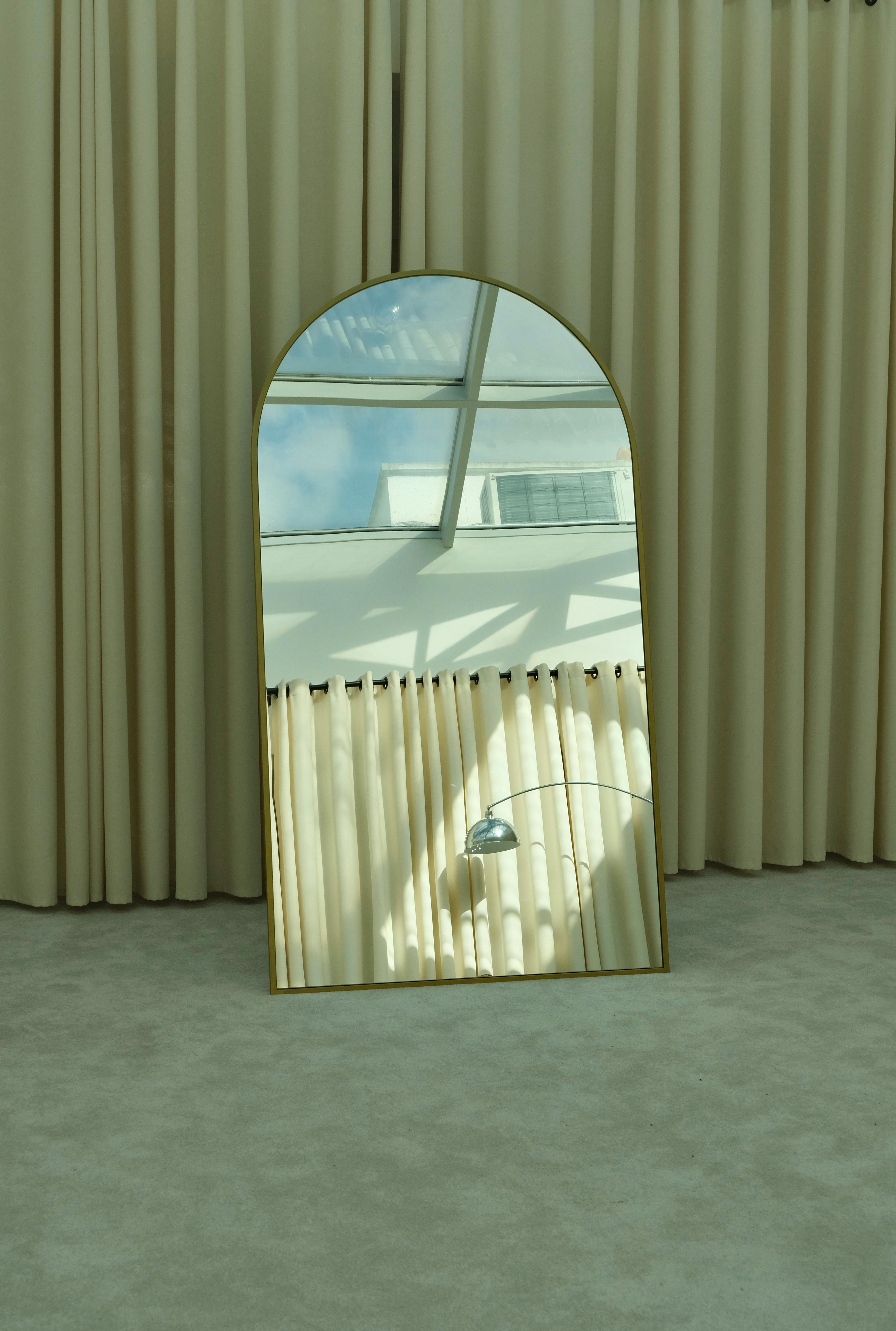 Elegant Mirror Reflection in Sunlit Room · Free Stock Photo