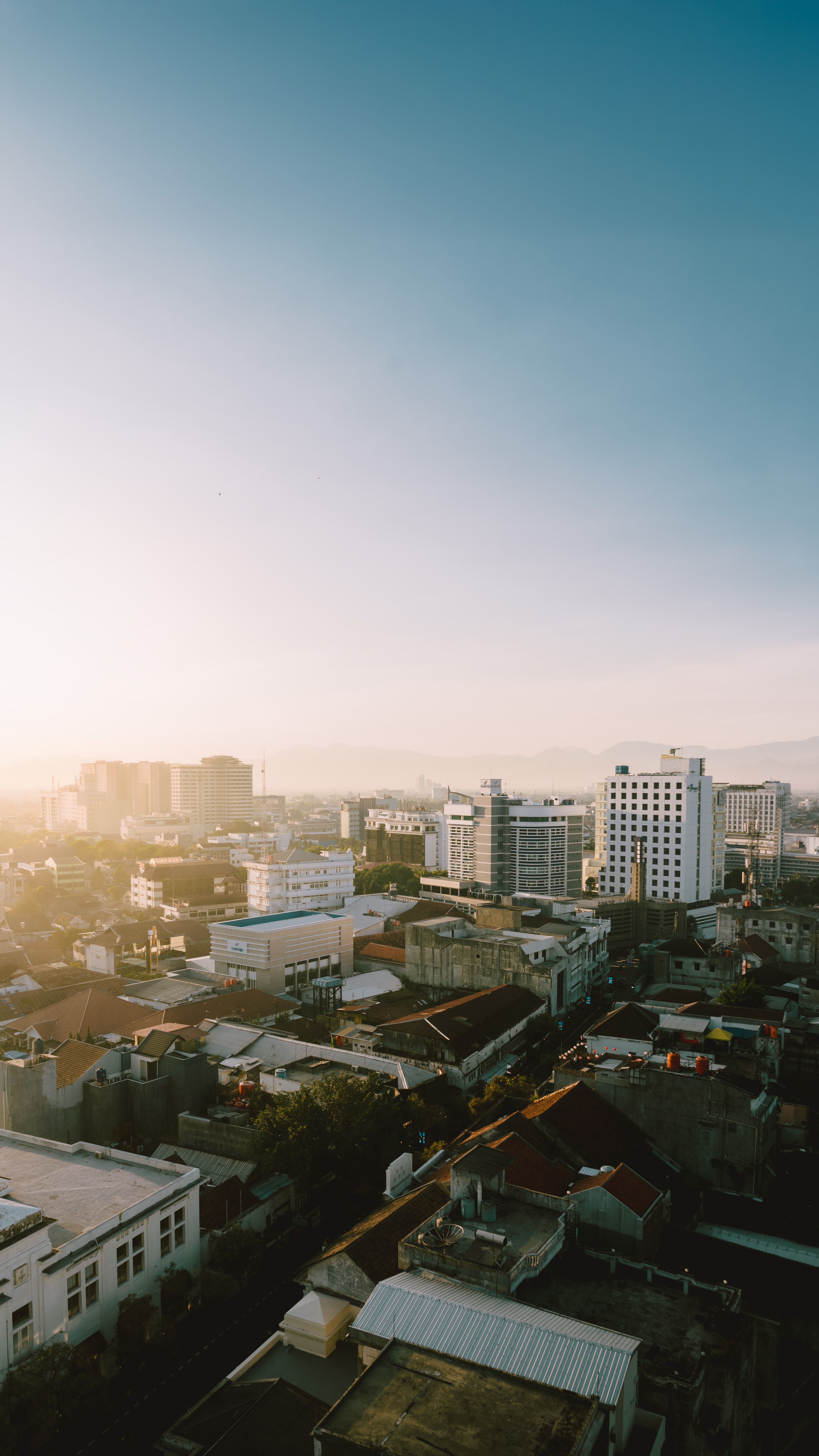 Aerial View of Urban Cityscape at Sunrise · Free Stock Photo
