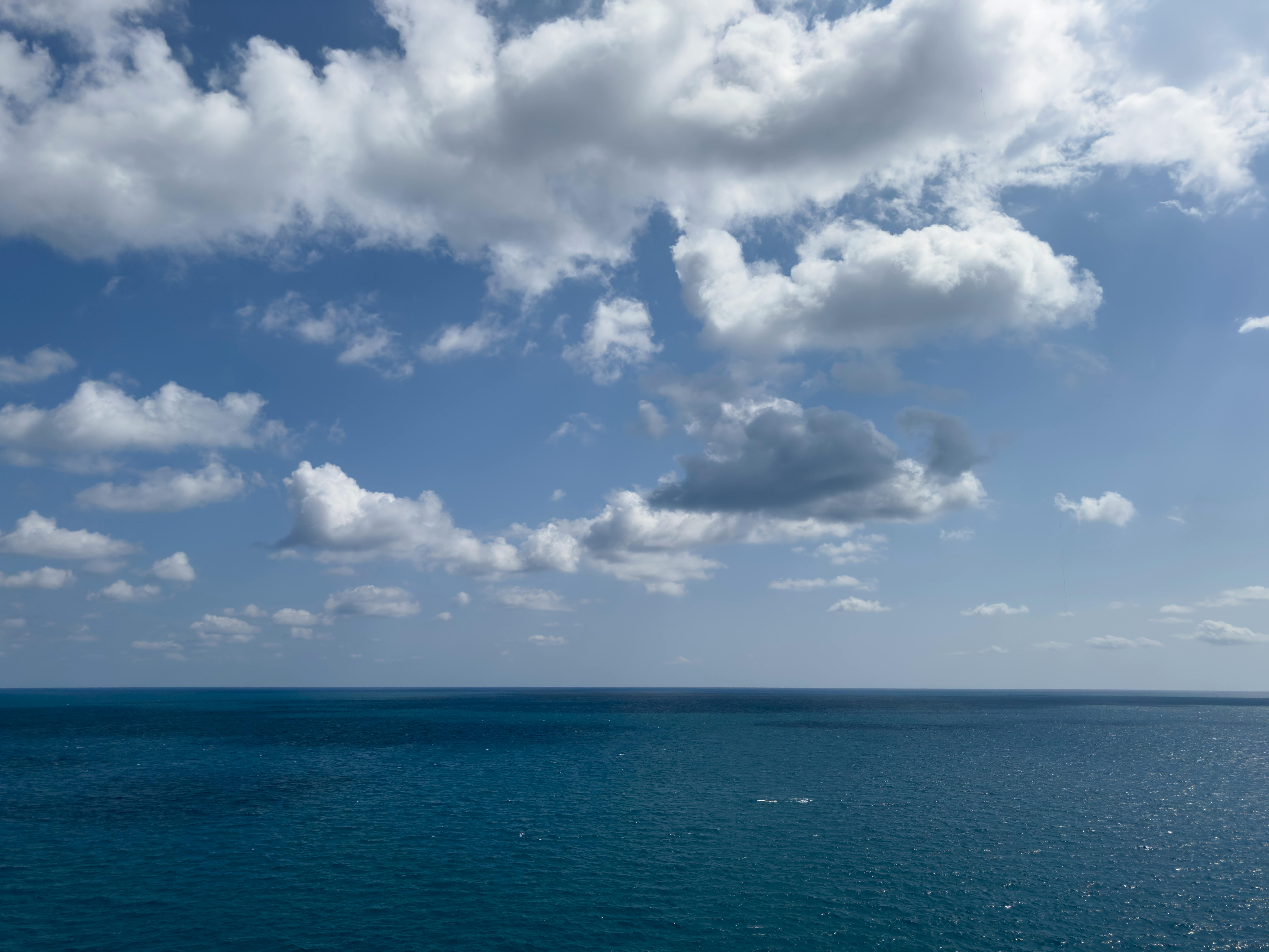 Peaceful Ocean View with Blue Sky and Clouds · Free Stock Photo