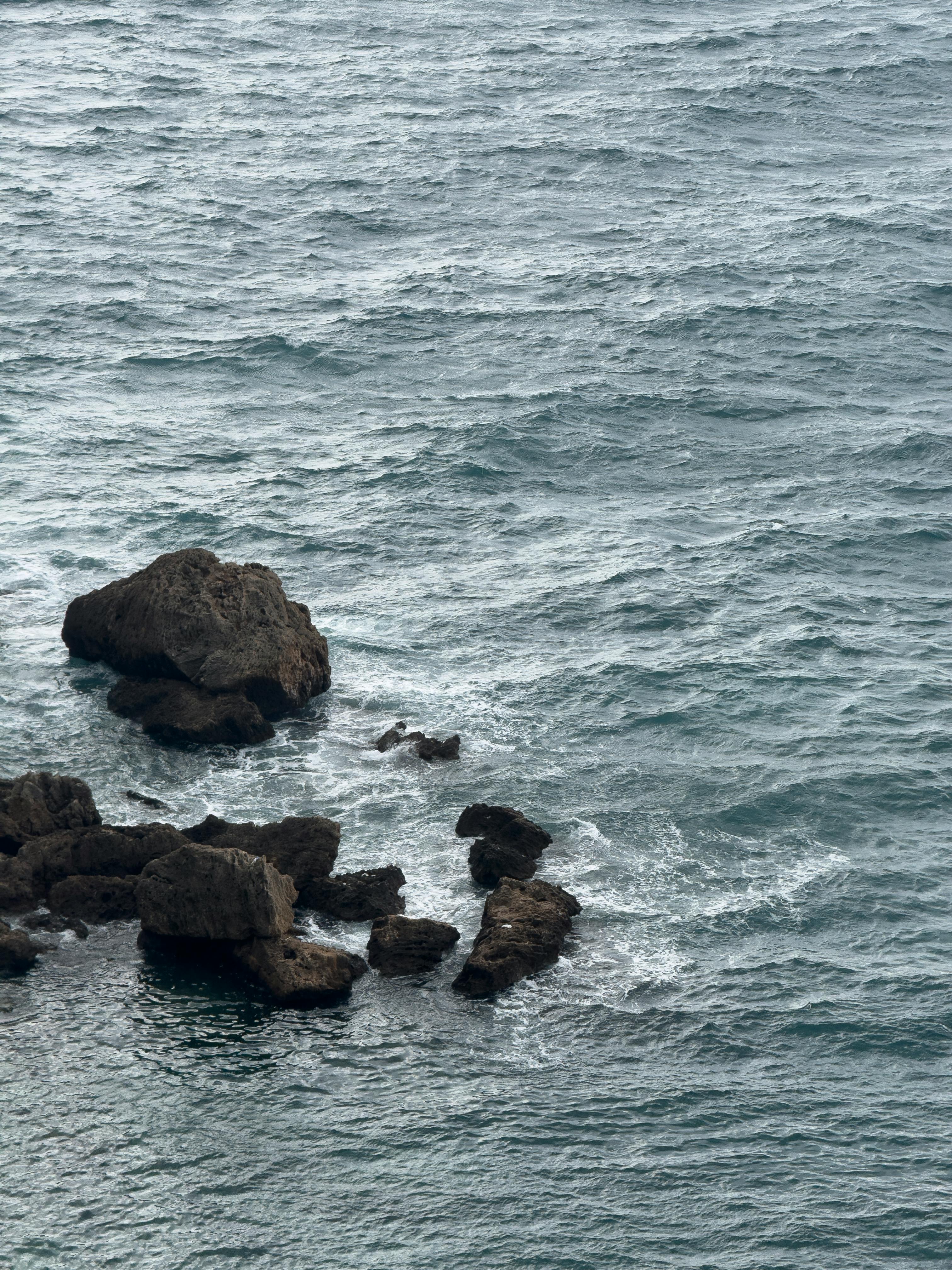 Rocky Coastal Seascape with Gentle Waves · Free Stock Photo