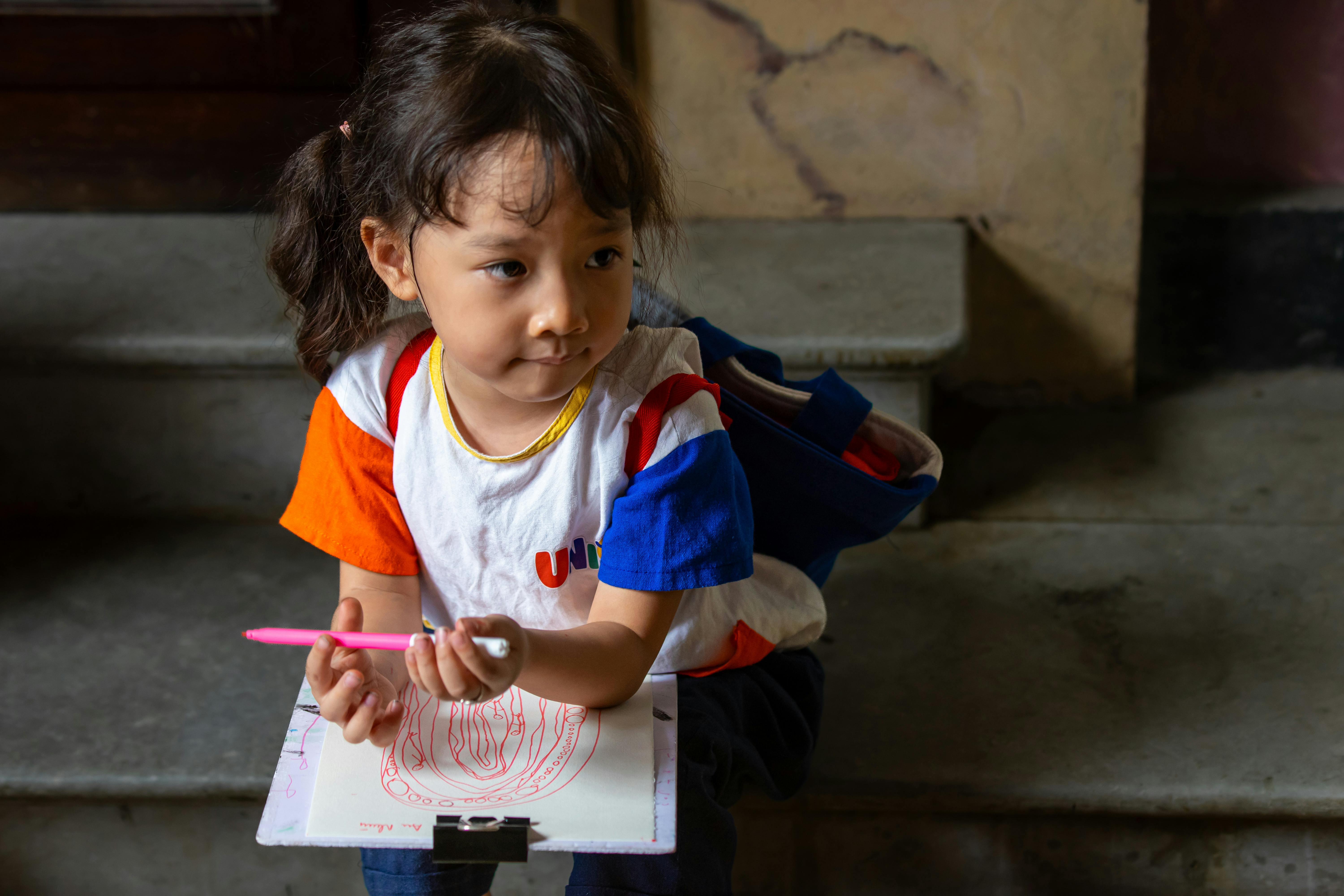 Young Child Drawing with Enthusiasm Indoors · Free Stock Photo