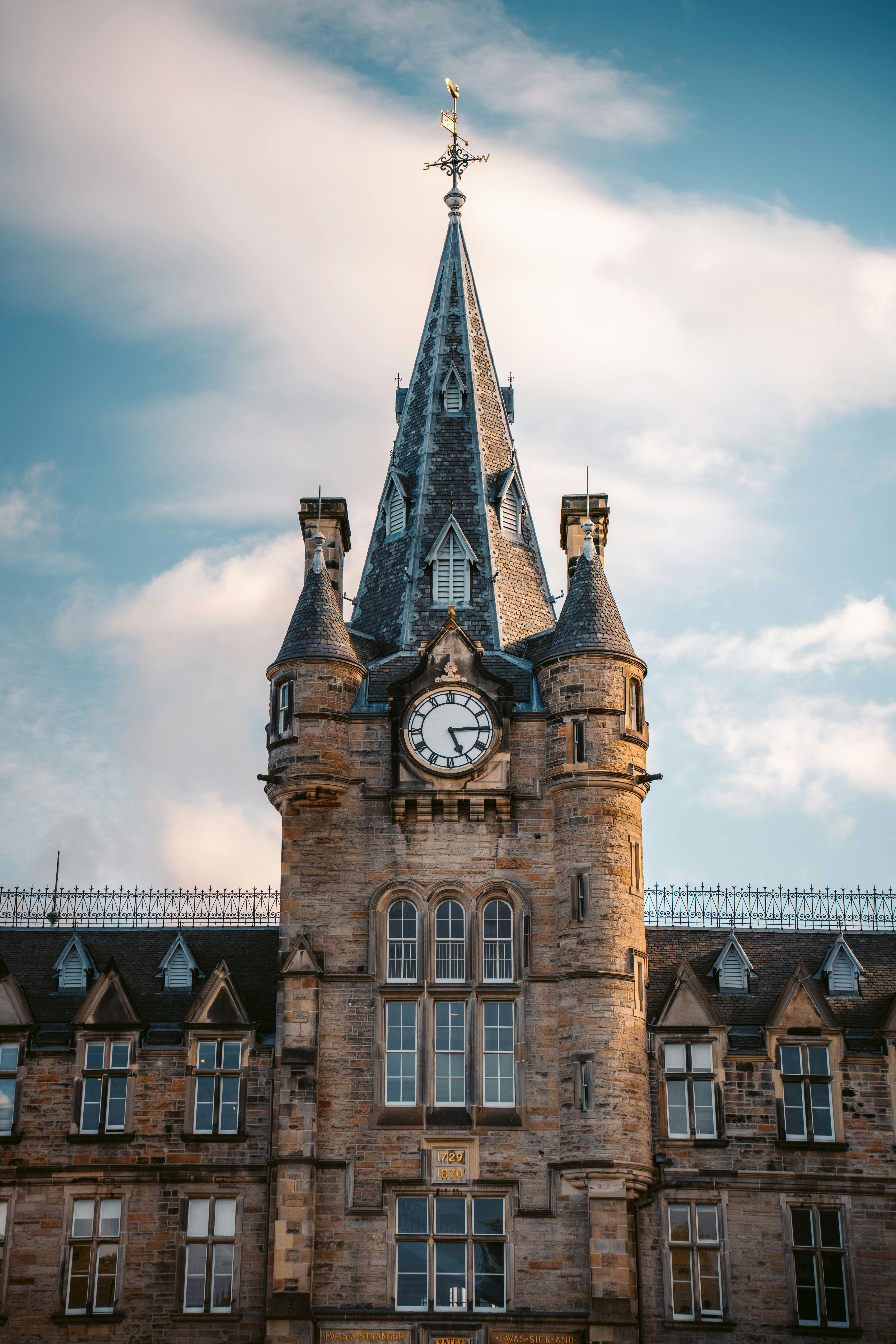 Majestic Clock Tower of Historic Building · Free Stock Photo