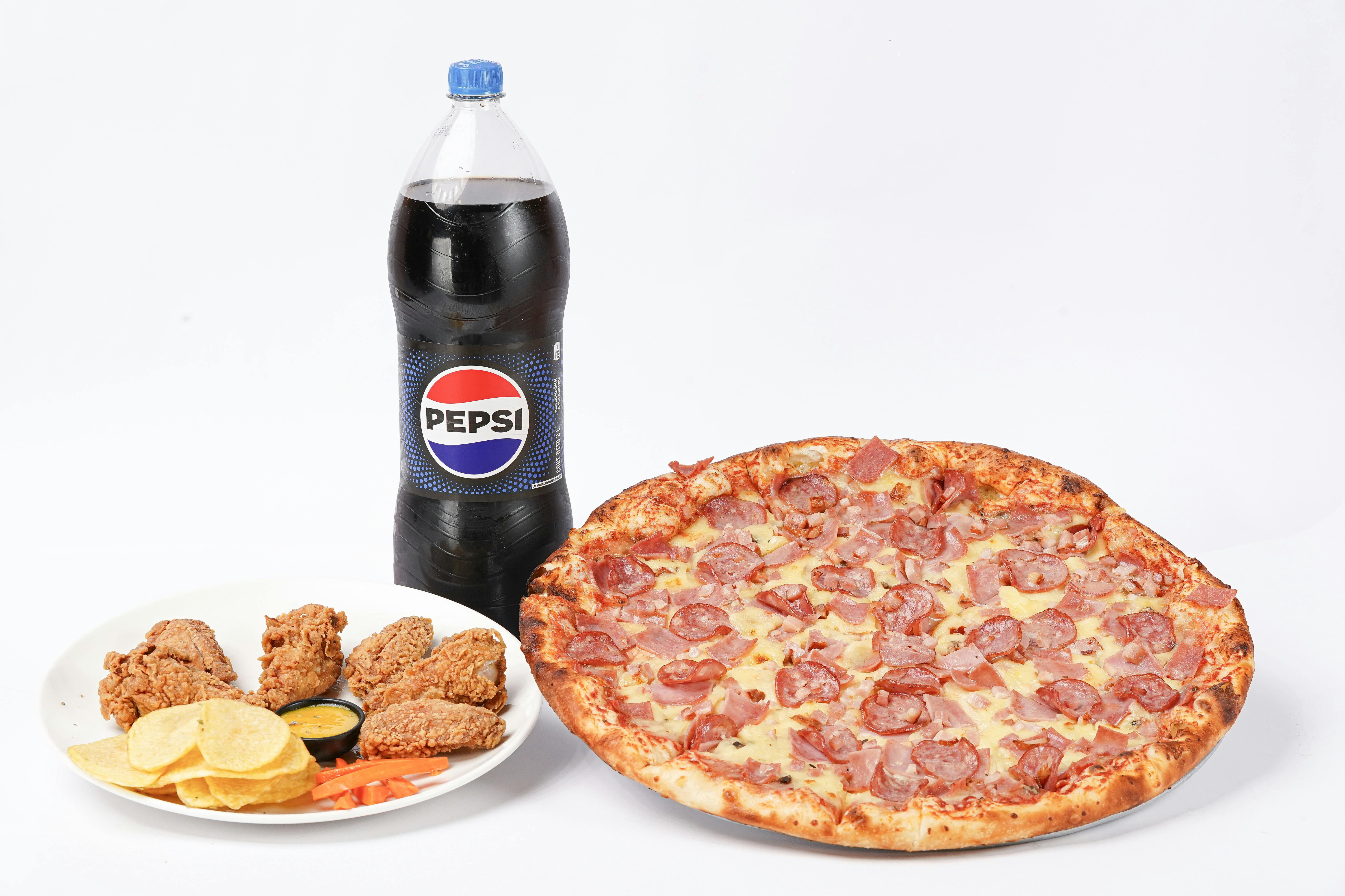 Delicious Pepperoni Pizza Meal with Pepsi · Free Stock Photo