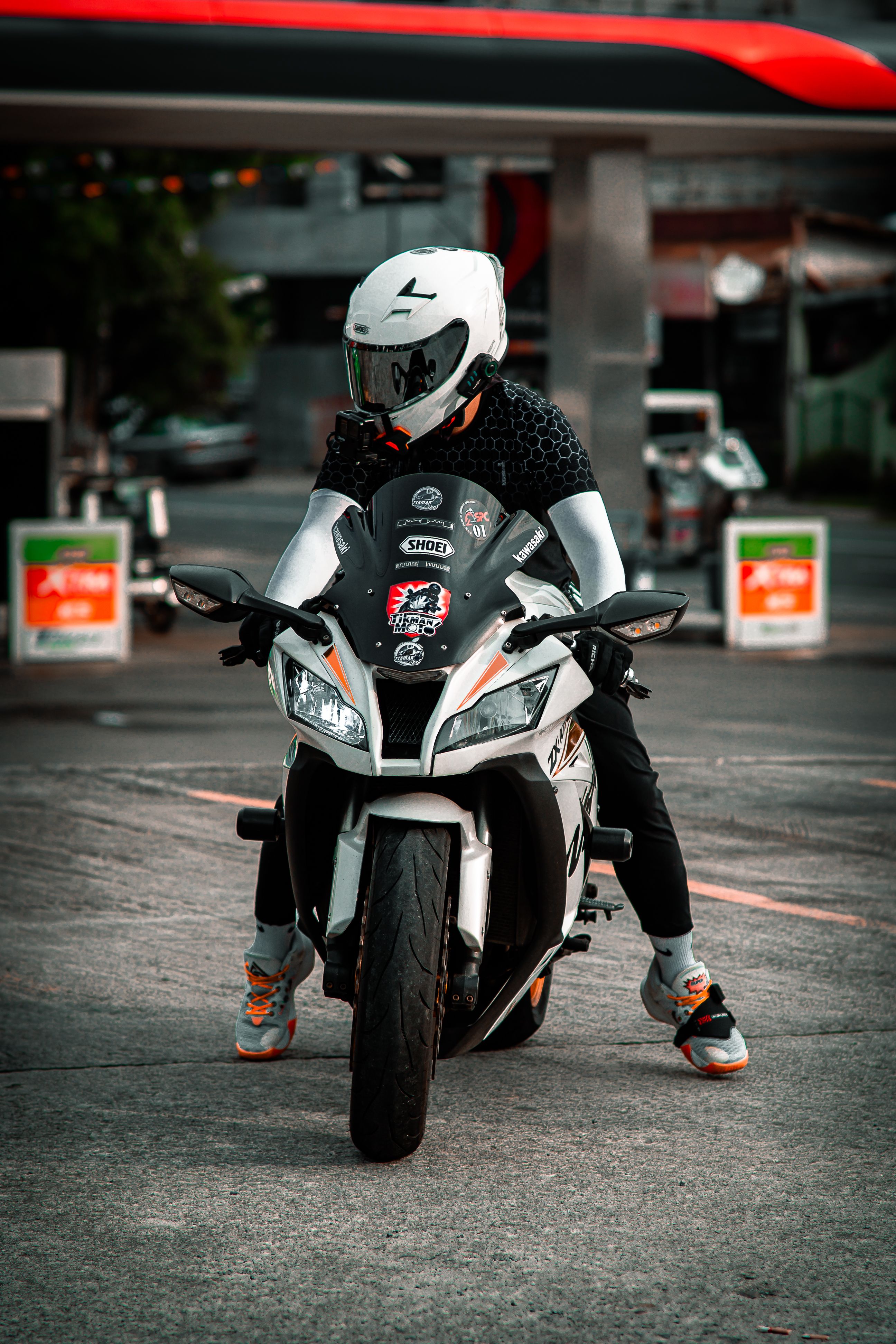 Rider on Motorcycle at Gas Station · Free Stock Photo