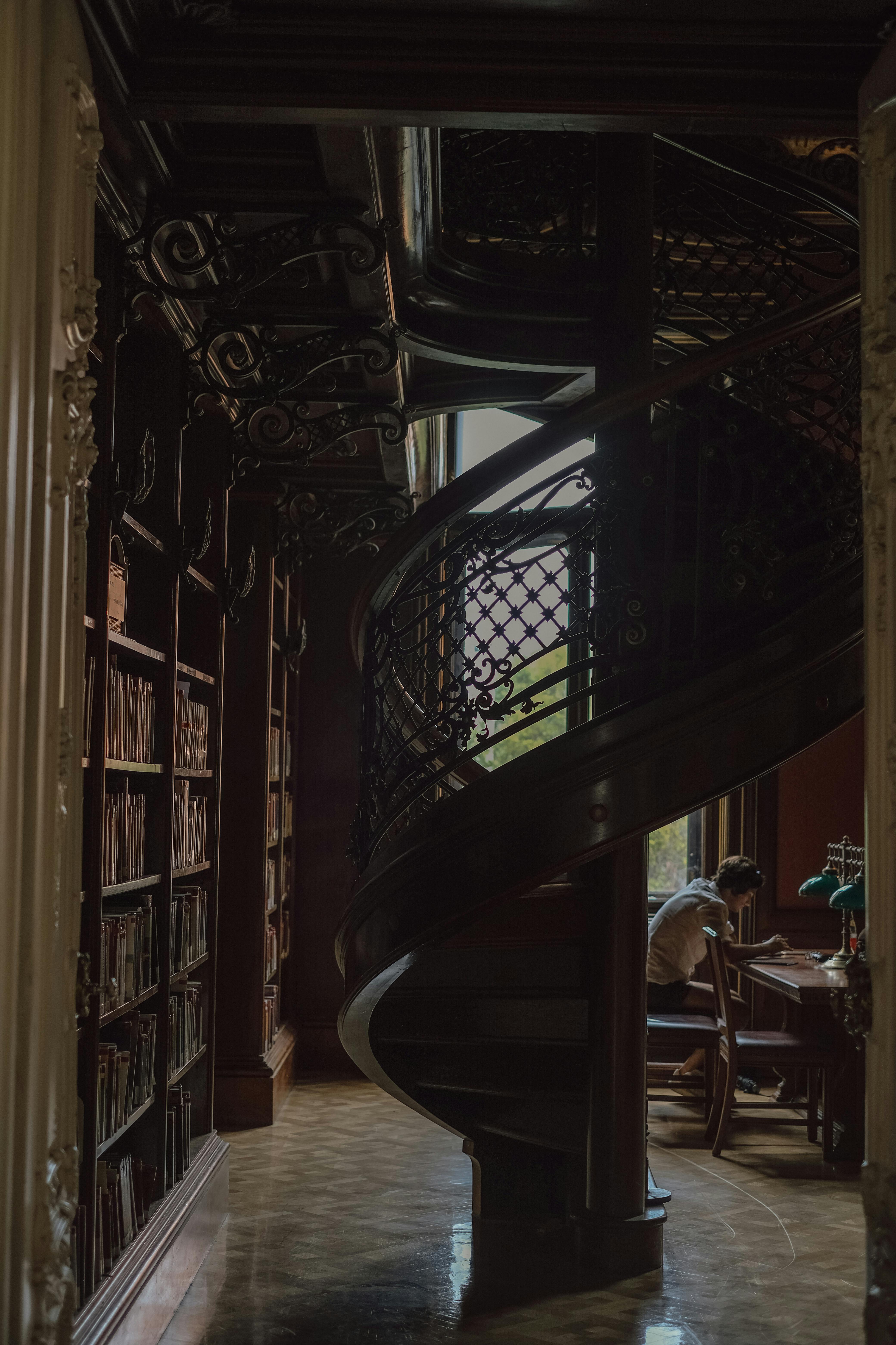 Vintage Library Interior with Spiral Staircase · Free Stock Photo