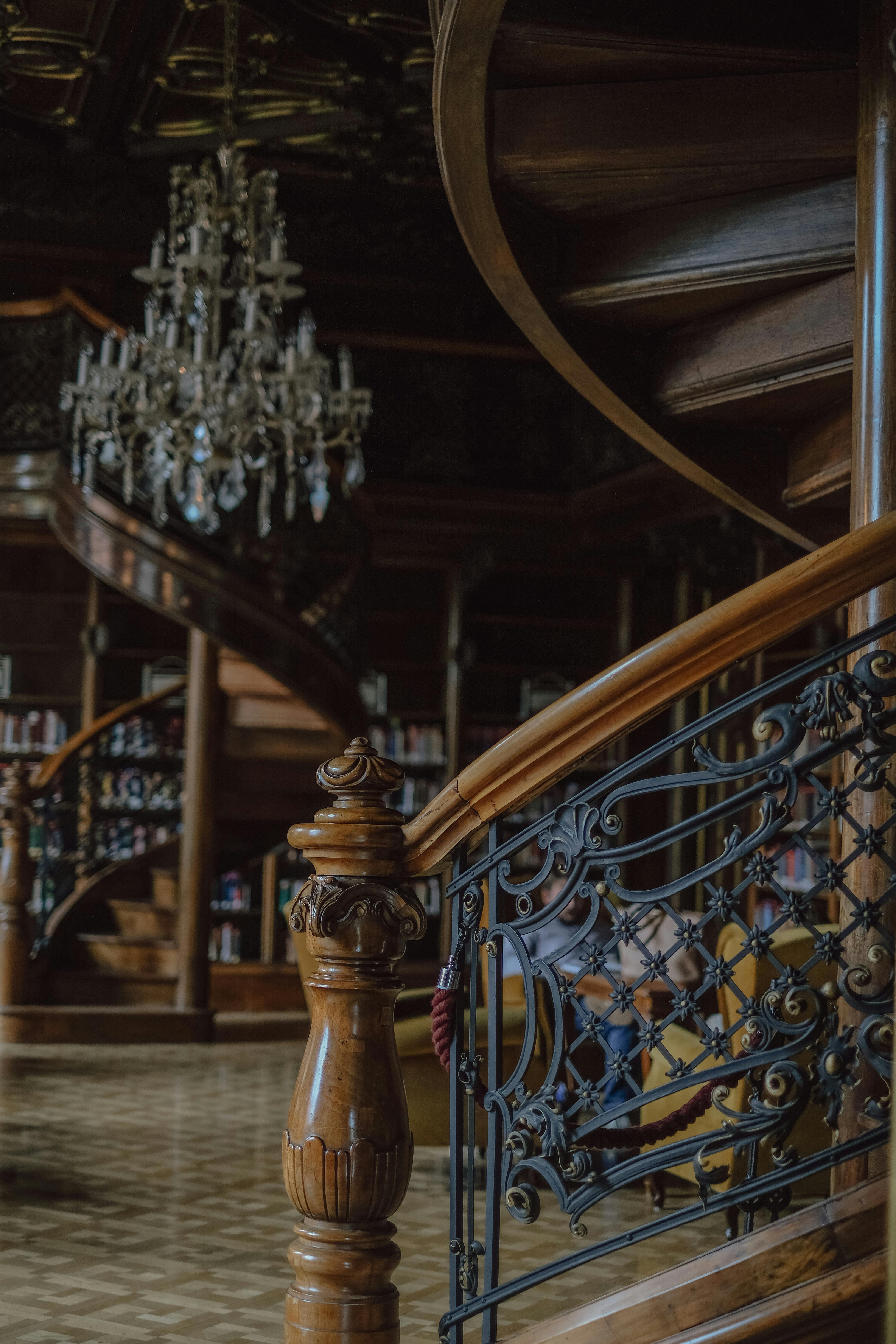 Elegant Spiral Staircase in Historic Library Setting · Free Stock Photo
