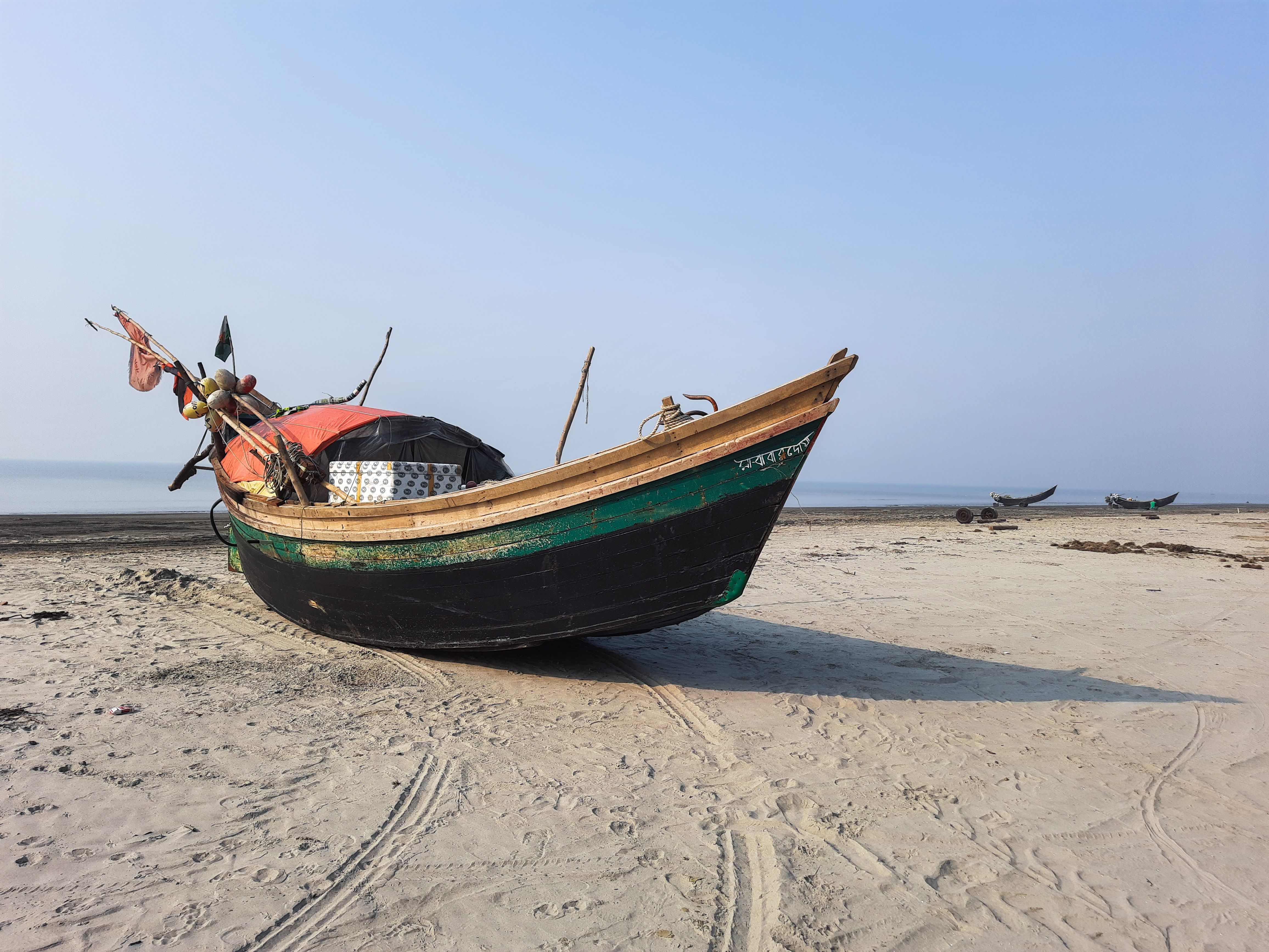 Traditional Fishing Boat on Barisal Beach · Free Stock Photo