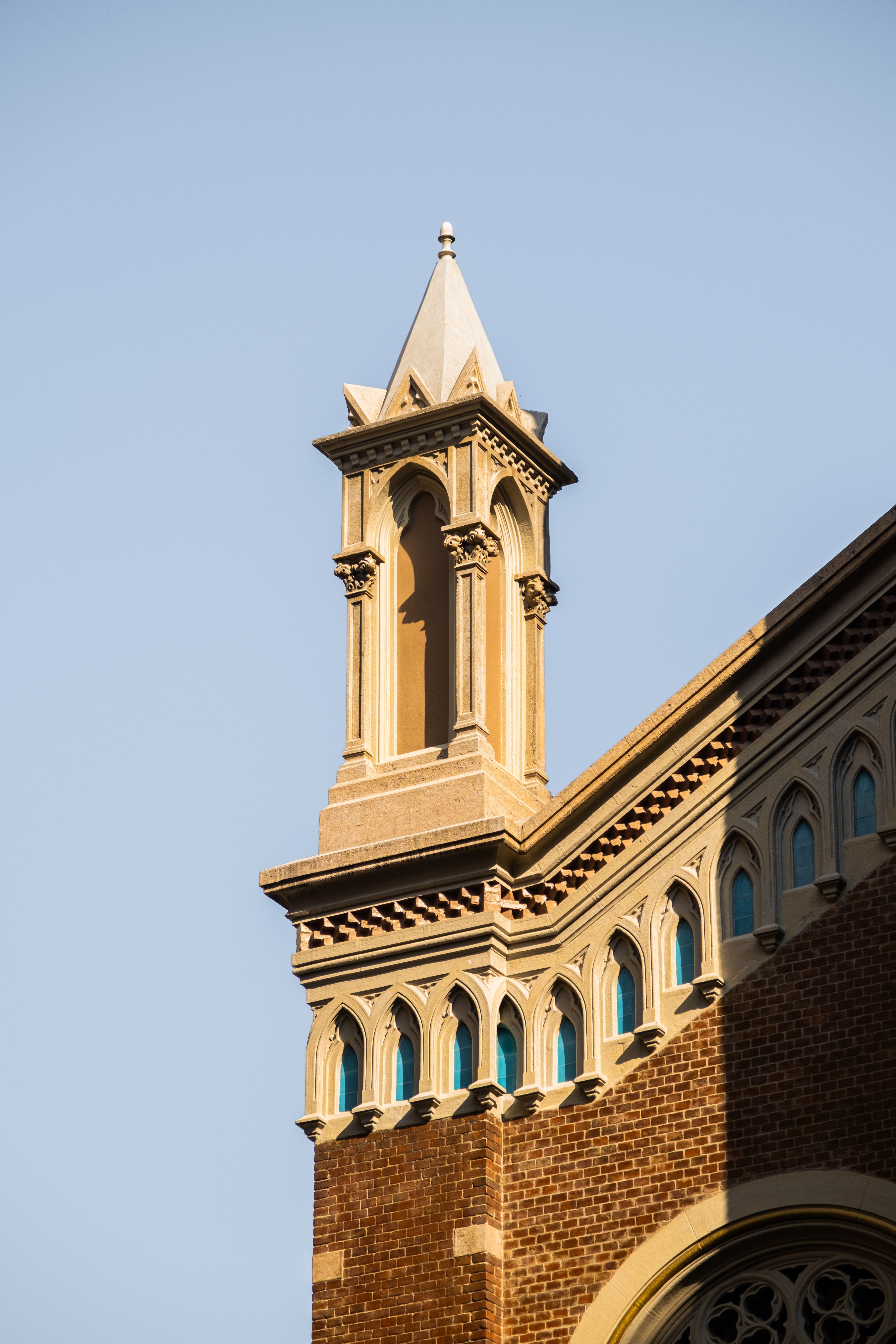 Ornate Gothic Spire Against Clear Sky · Free Stock Photo
