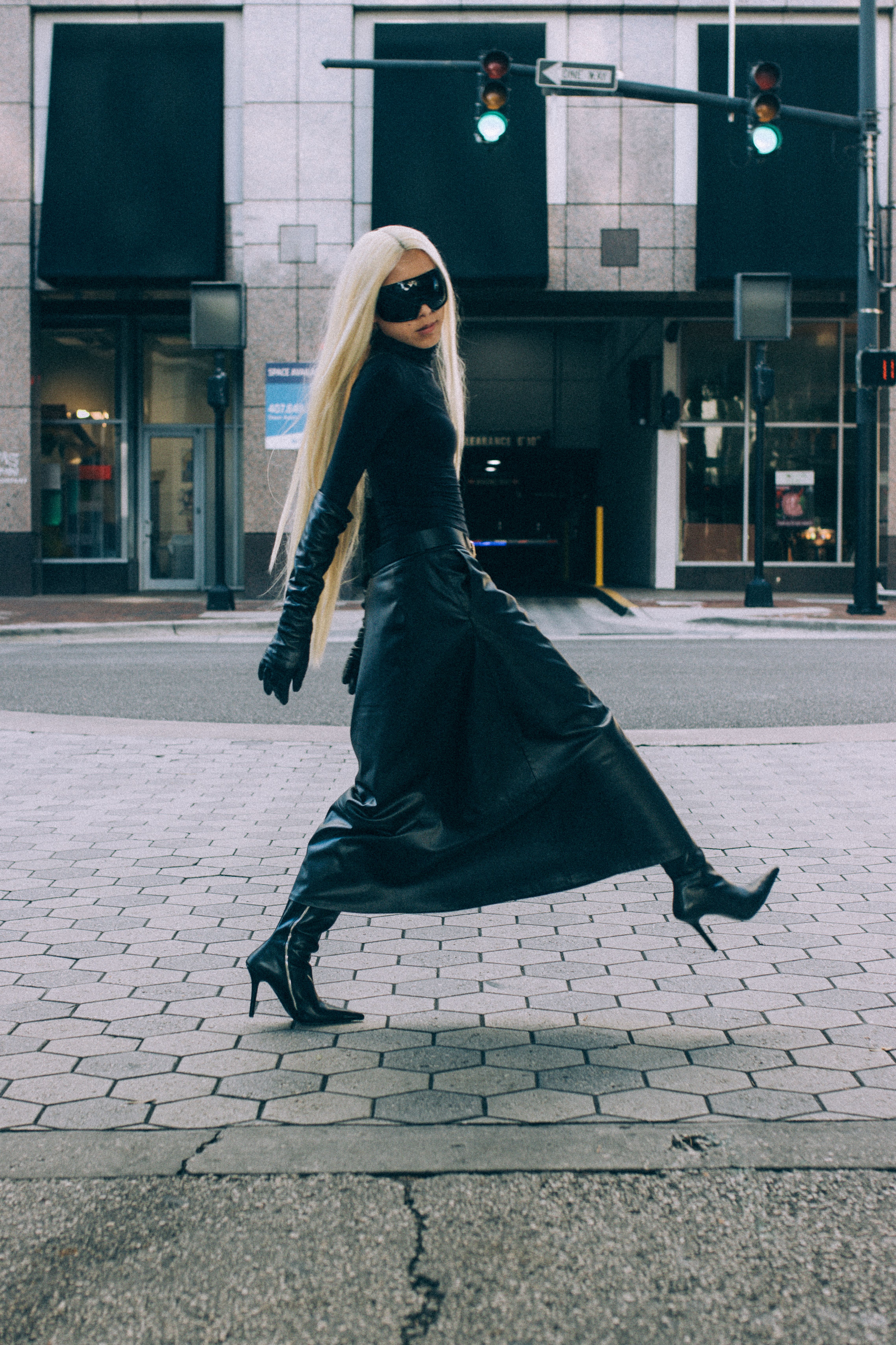 Fashionable model crossing city street in style · Free Stock Photo
