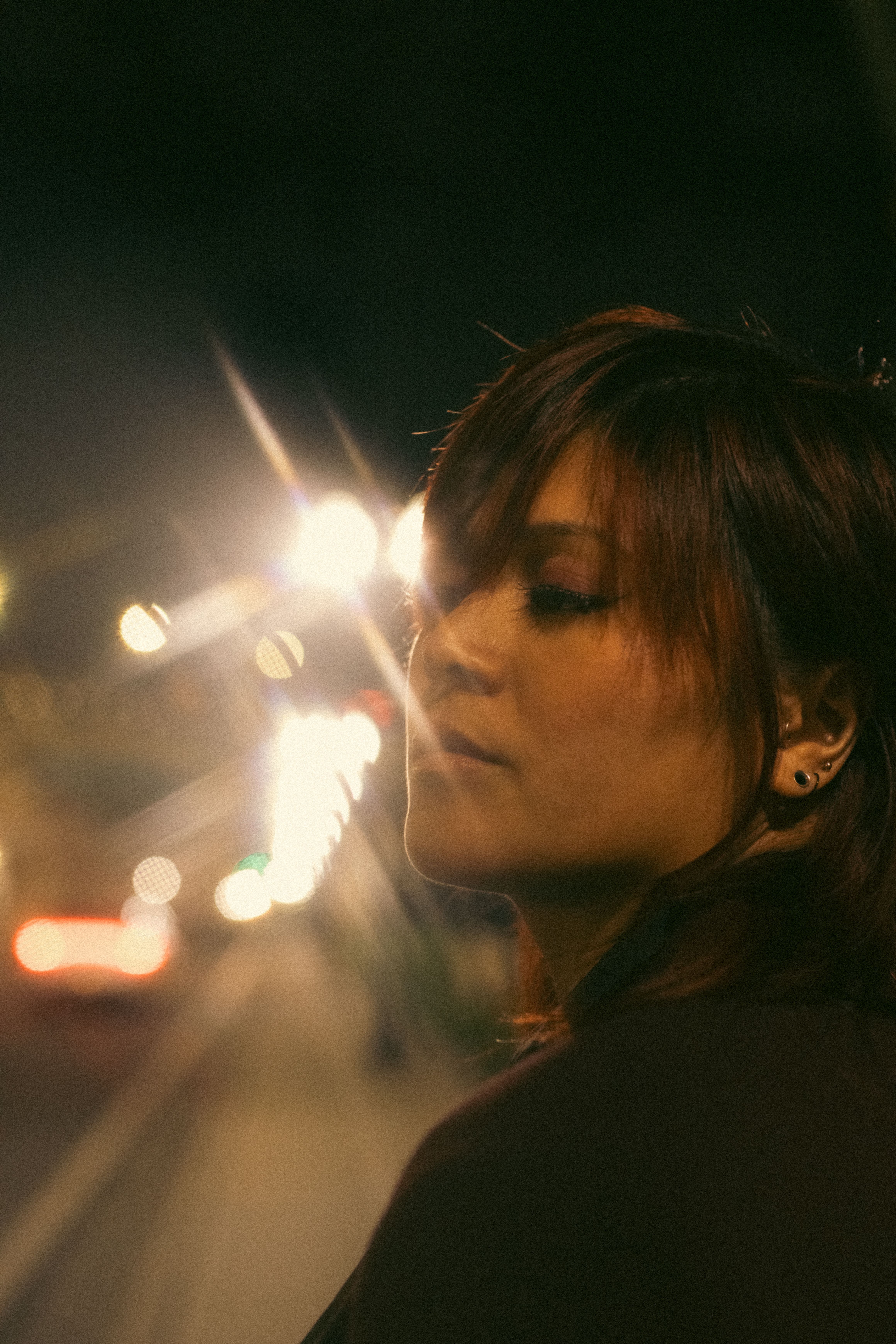 Dreamy Night Portrait with Streetlights Bokeh · Free Stock Photo