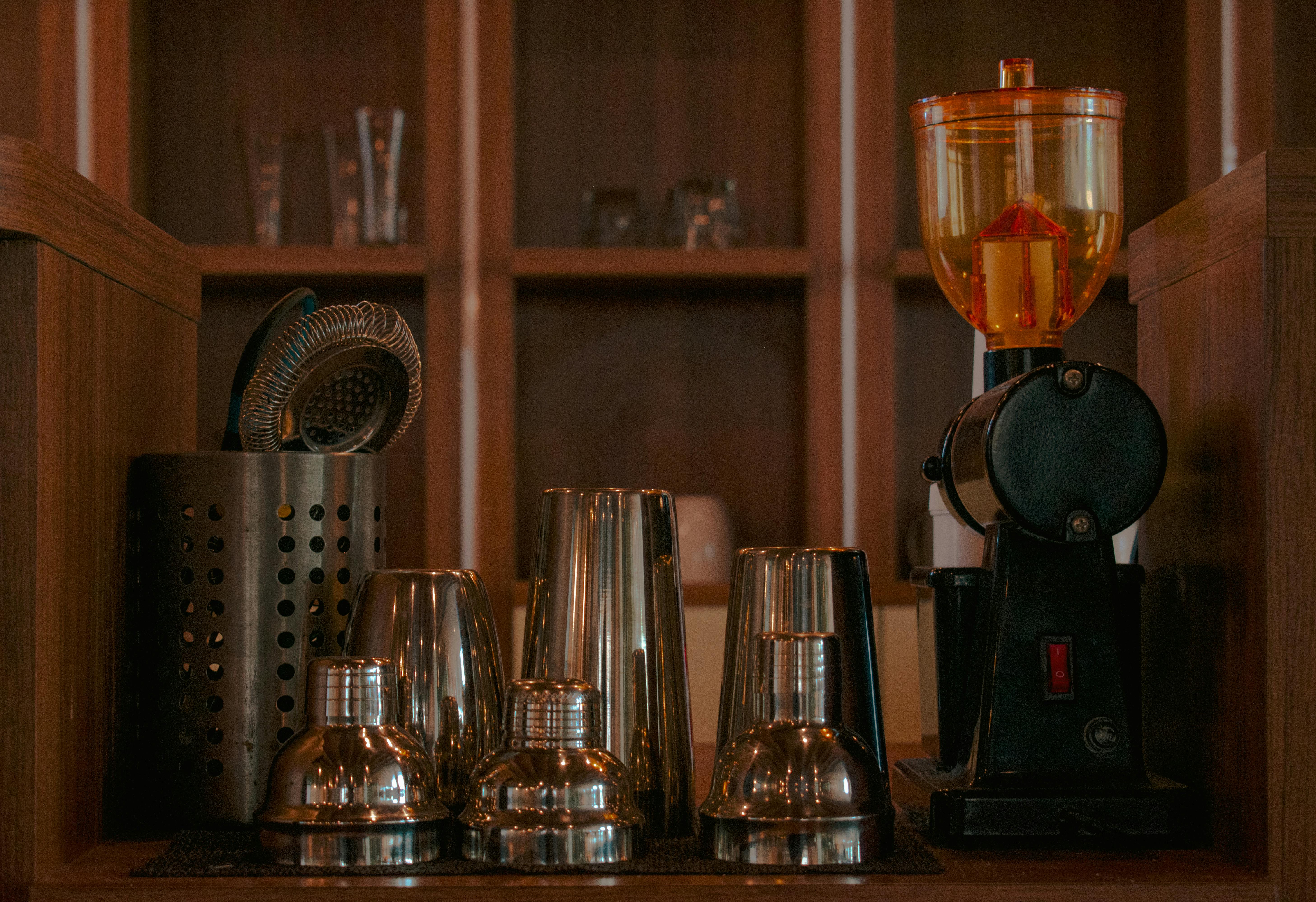 Bar Tools and Coffee Grinder on Wooden Shelves · Free Stock Photo