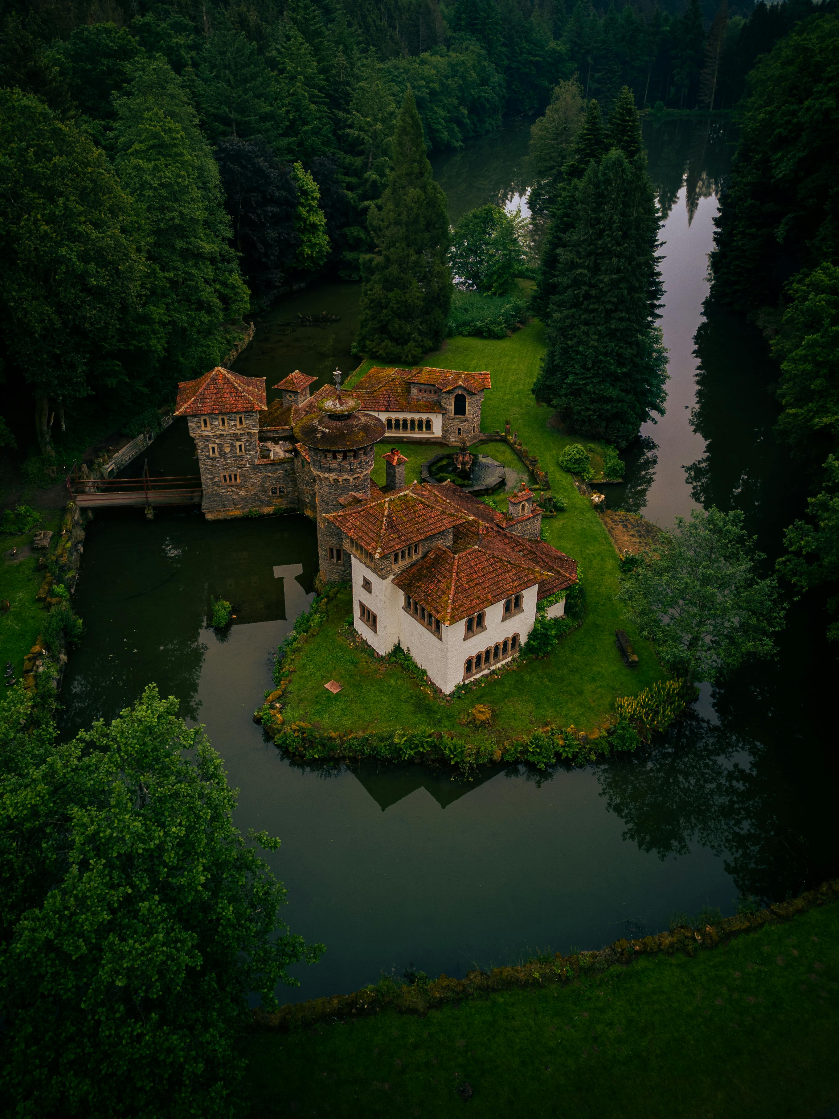 Scenic Drone View of Ancient Castle in Forest · Free Stock Photo