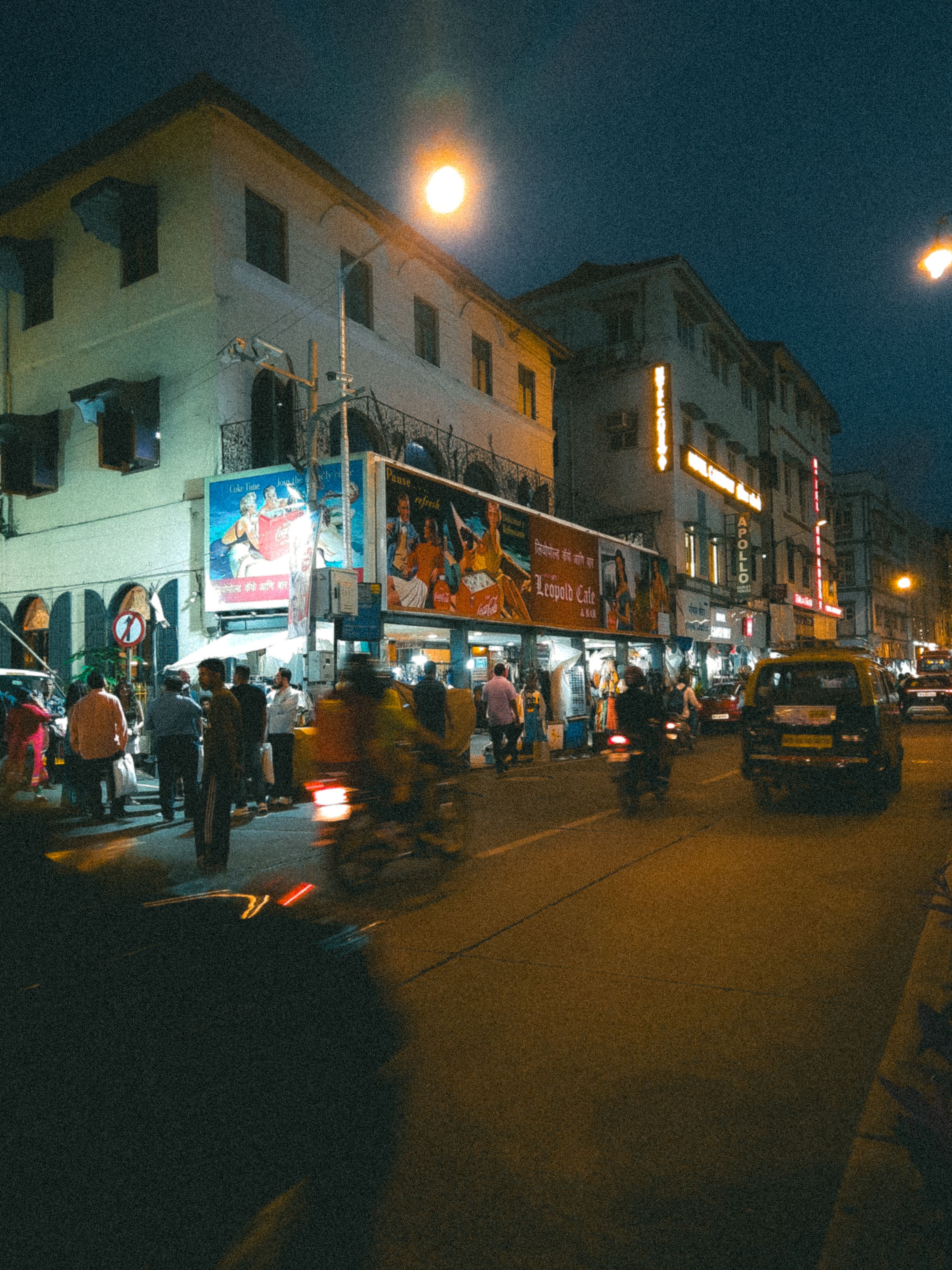 Bustling Evening Street Scene with Traffic · Free Stock Photo