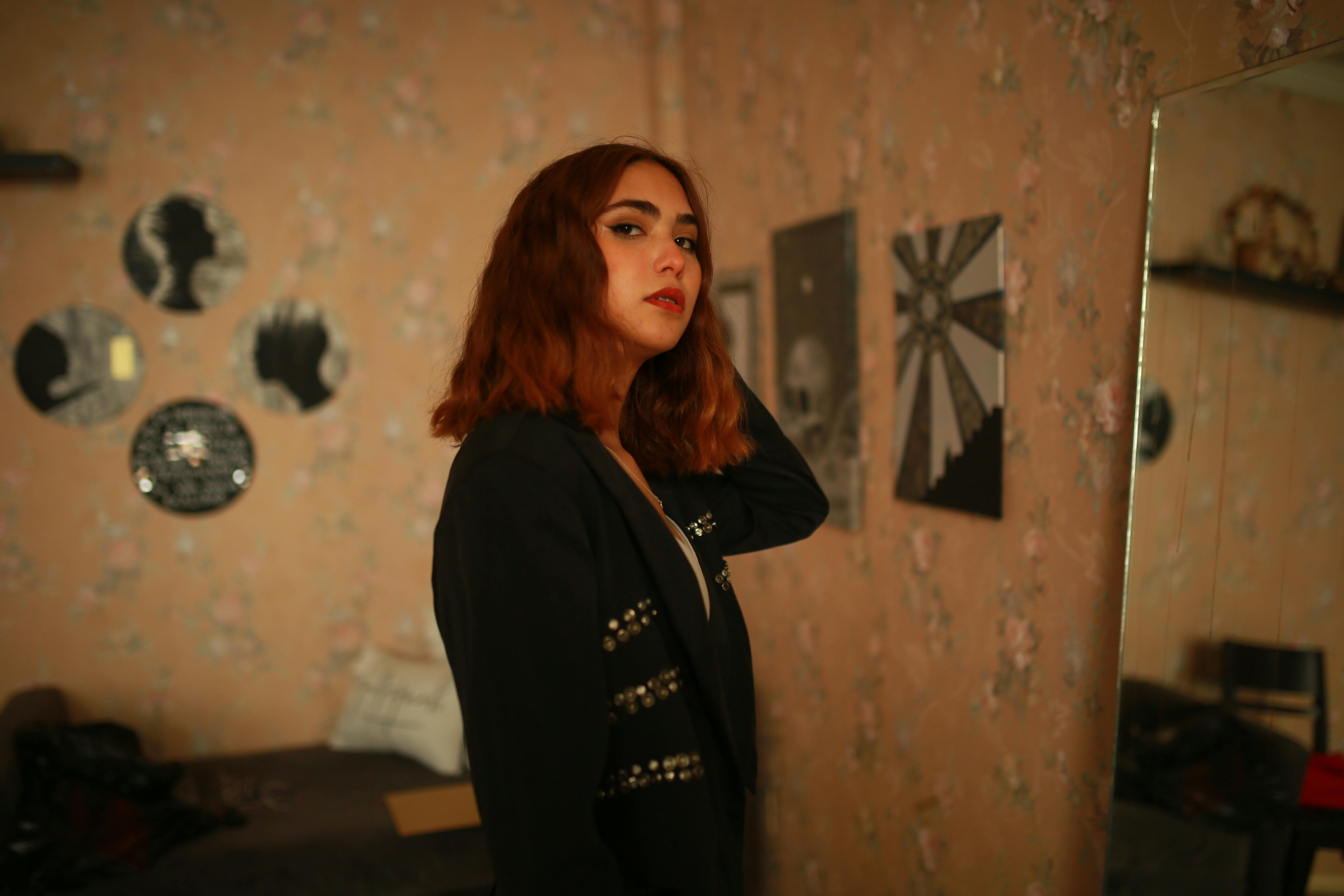 Elegant Woman in Reflective Portrait at Home · Free Stock Photo