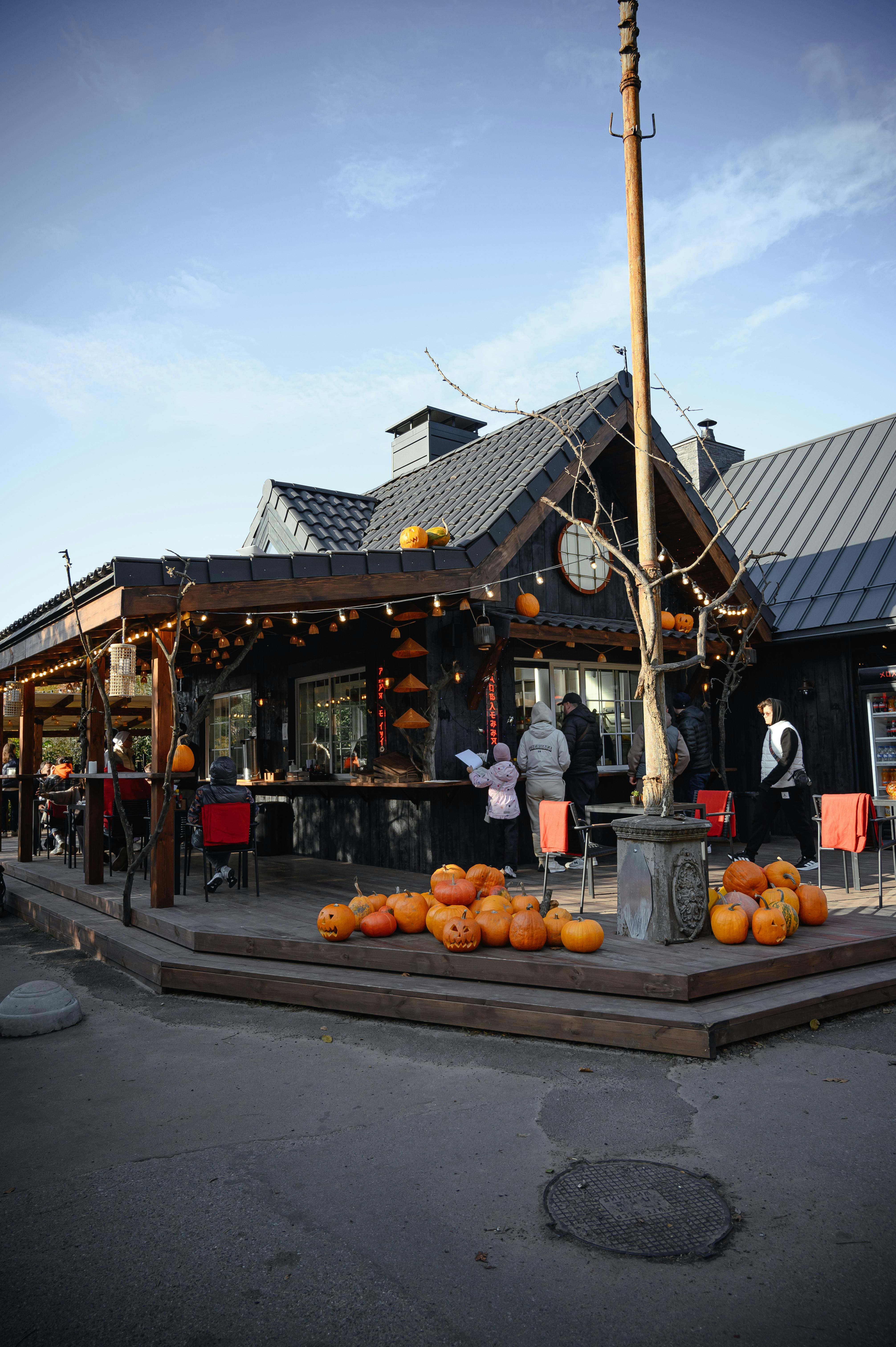 Cozy Cafe with Pumpkins in Autumn Kyiv · Free Stock Photo