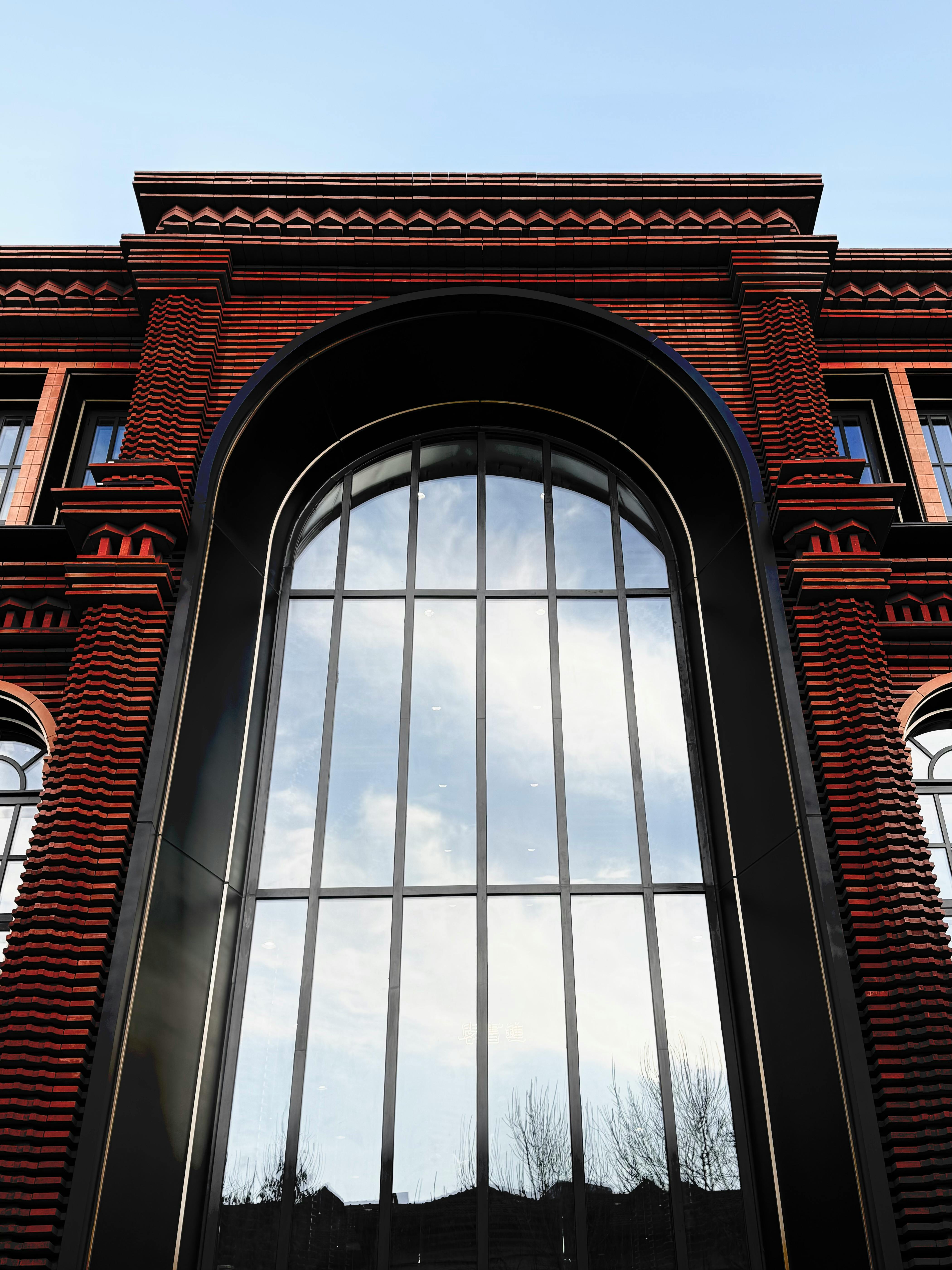 Tall Arched Window on Brick Building Exterior · Free Stock Photo