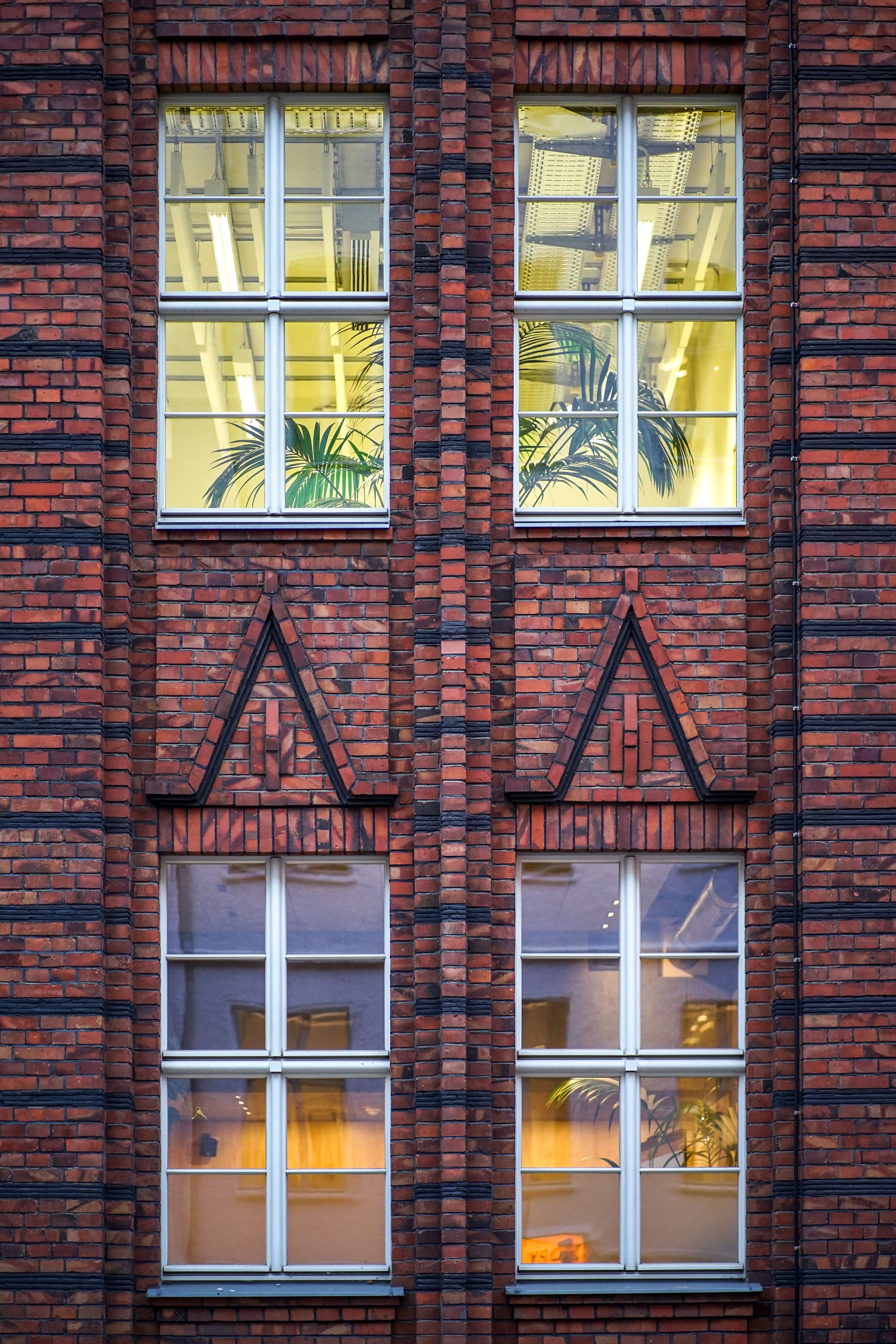 Brick Building Facade with Windows and Lights · Free Stock Photo