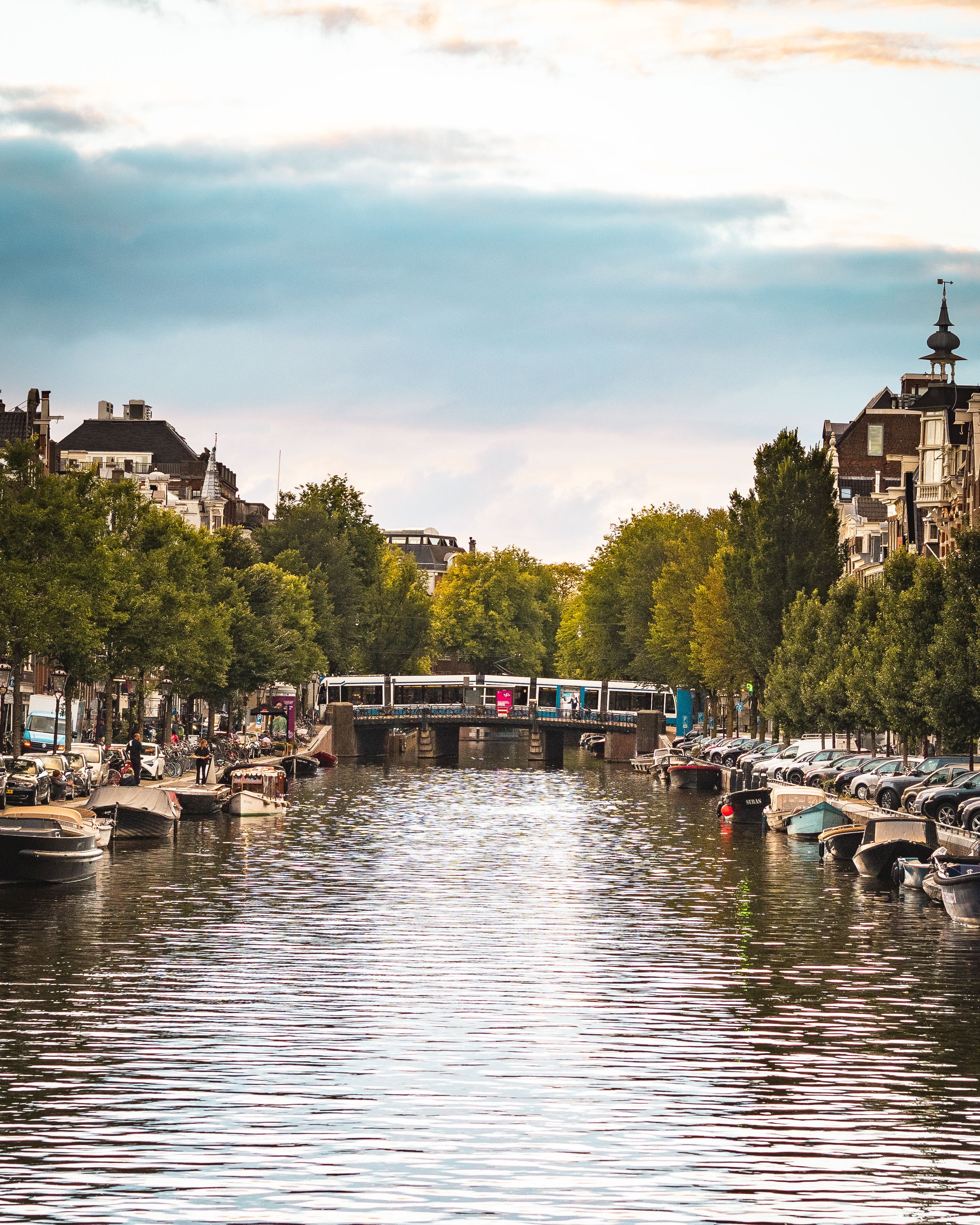 Charming Amsterdam Canal with Urban Landscape · Free Stock Photo