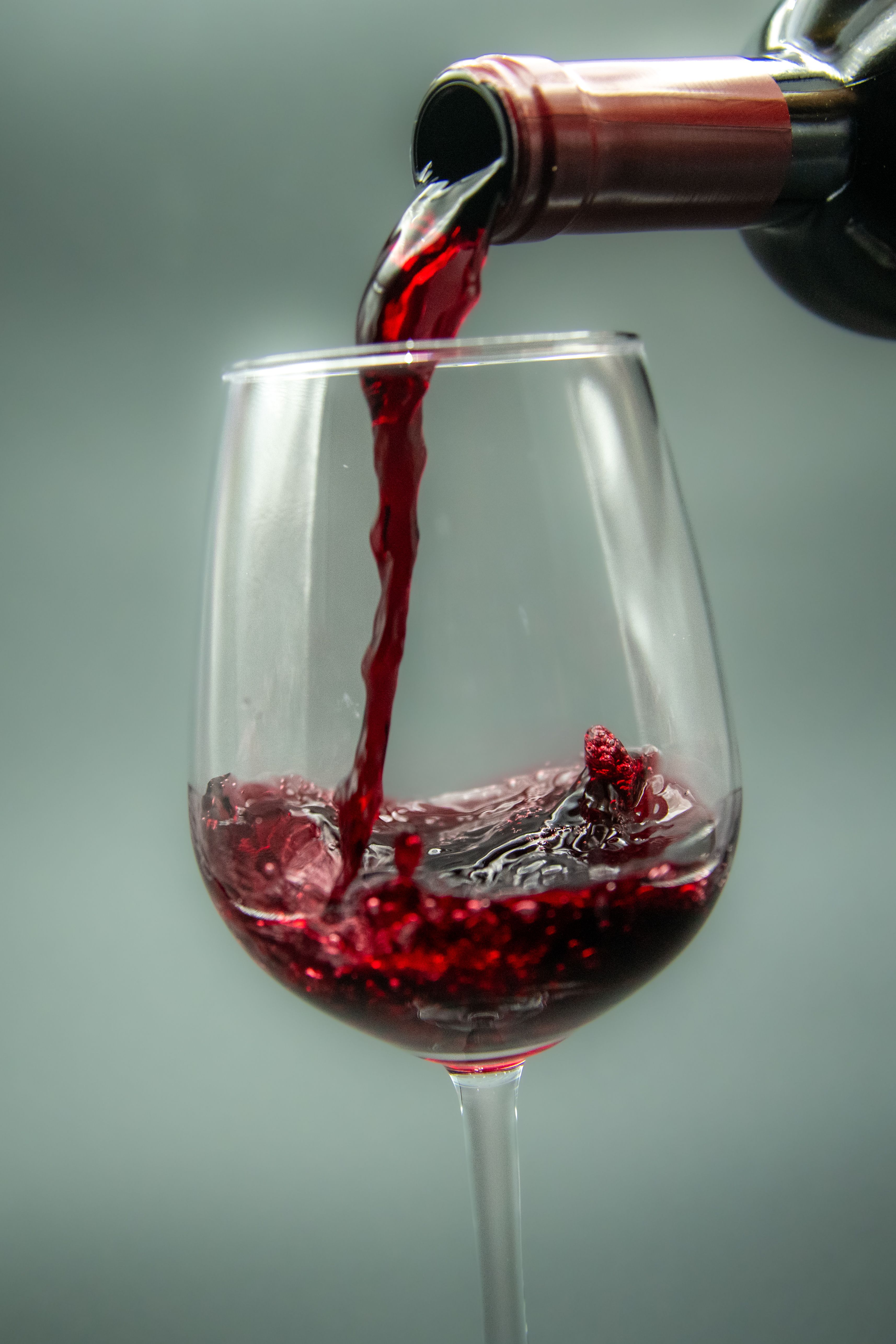 Red Wine Pouring into Glass Close-Up Shot · Free Stock Photo
