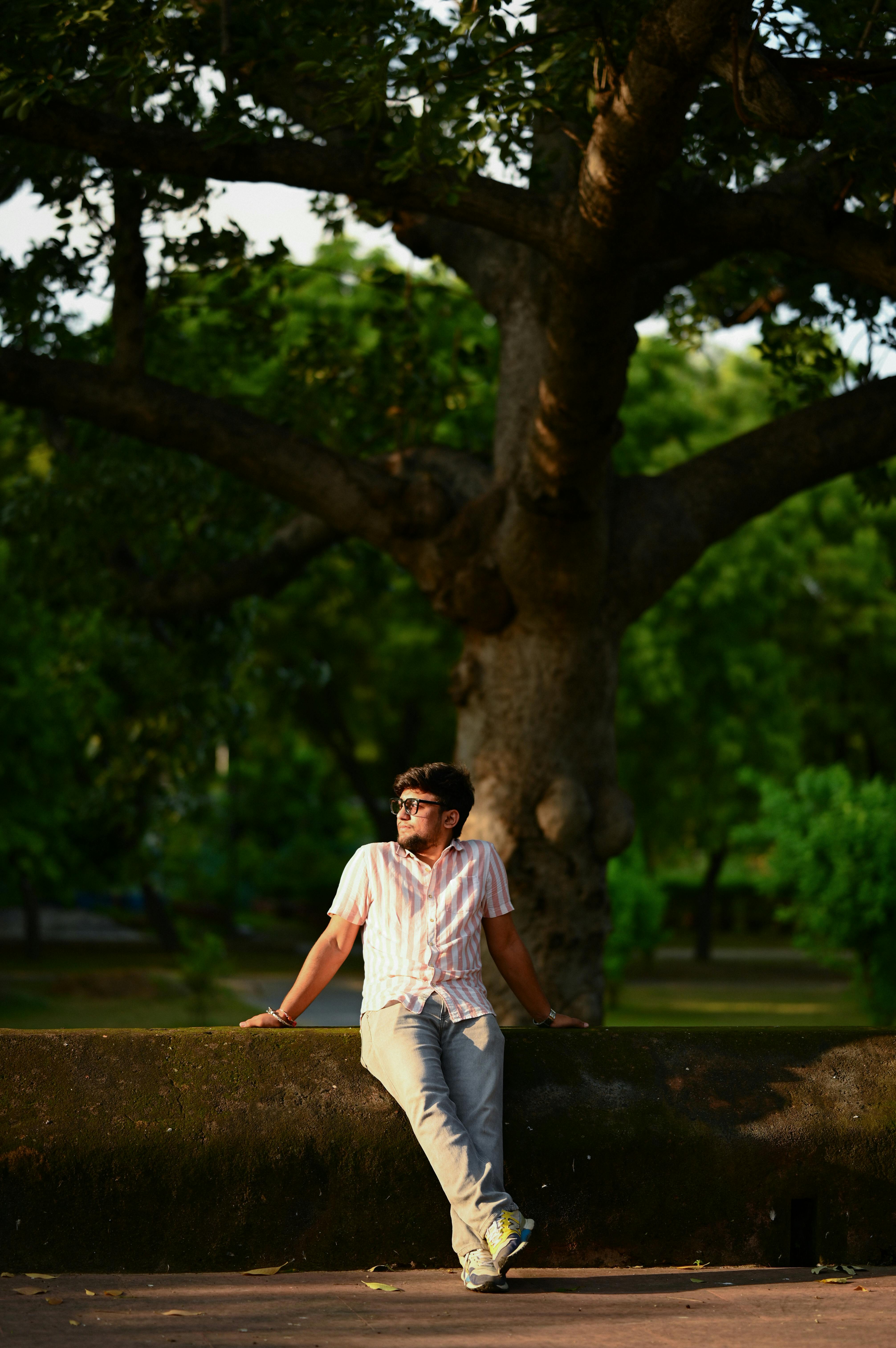 Man Relaxing Under a Tree in New Delhi Park · Free Stock Photo