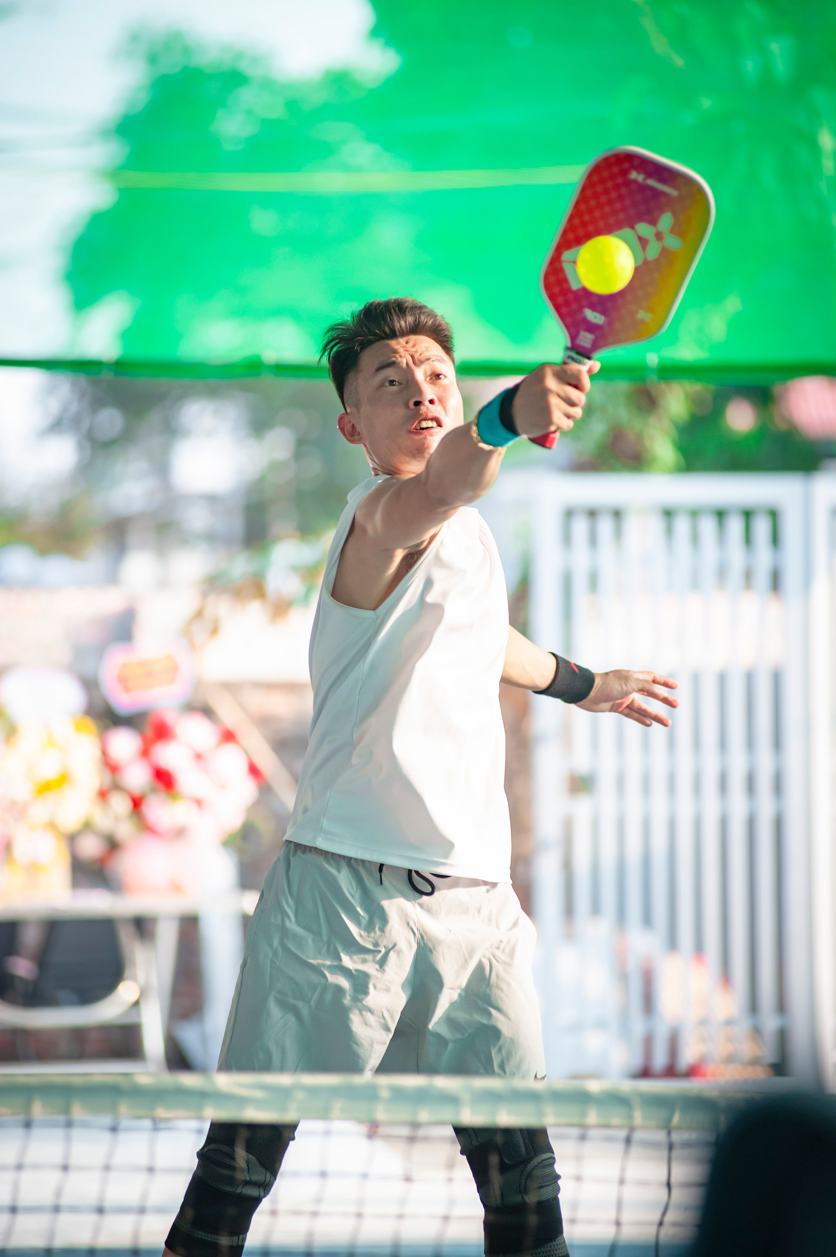 Young man playing pickleball in Hanoi · Free Stock Photo