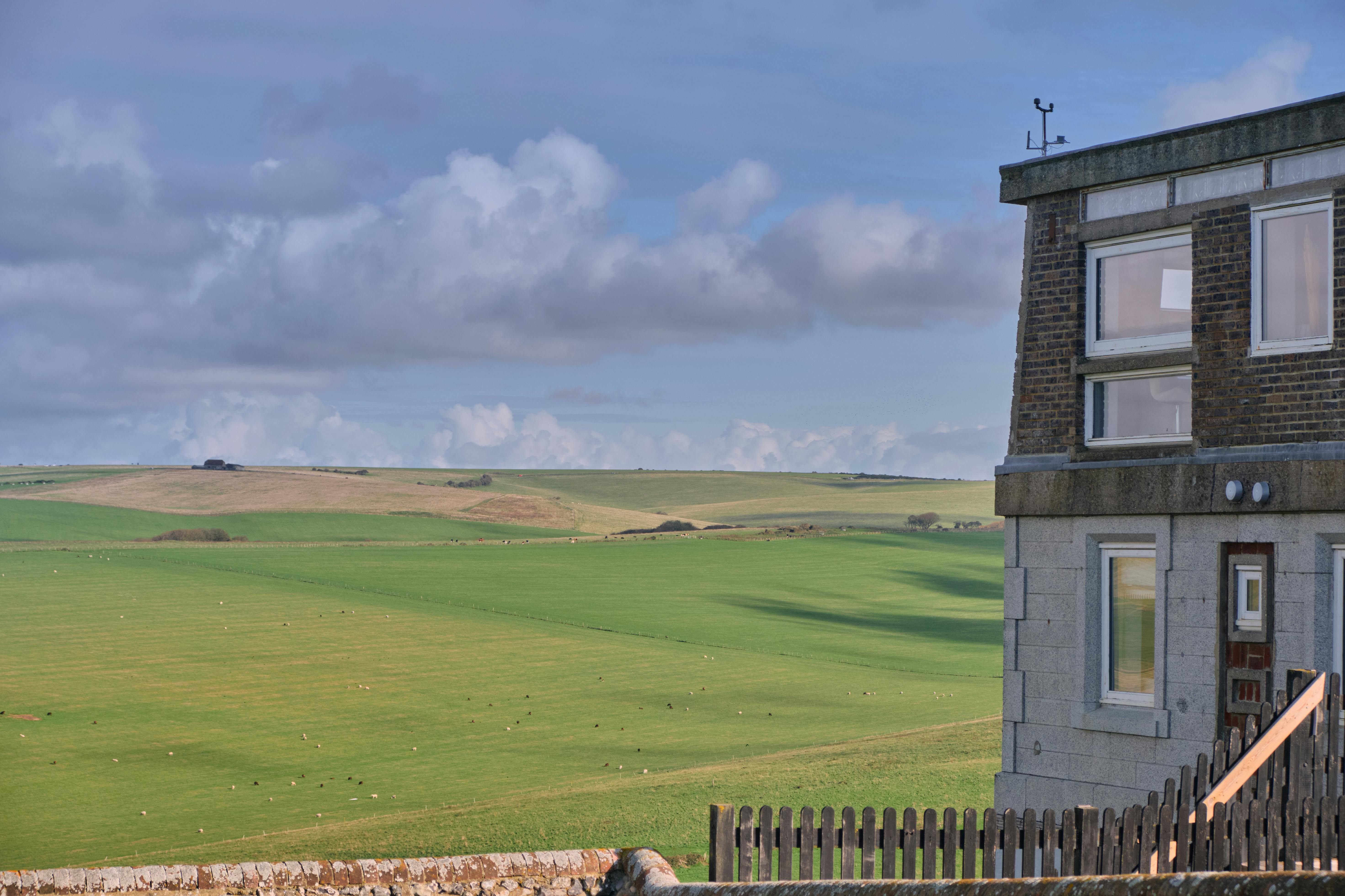Scenic Countryside View with Modern House · Free Stock Photo