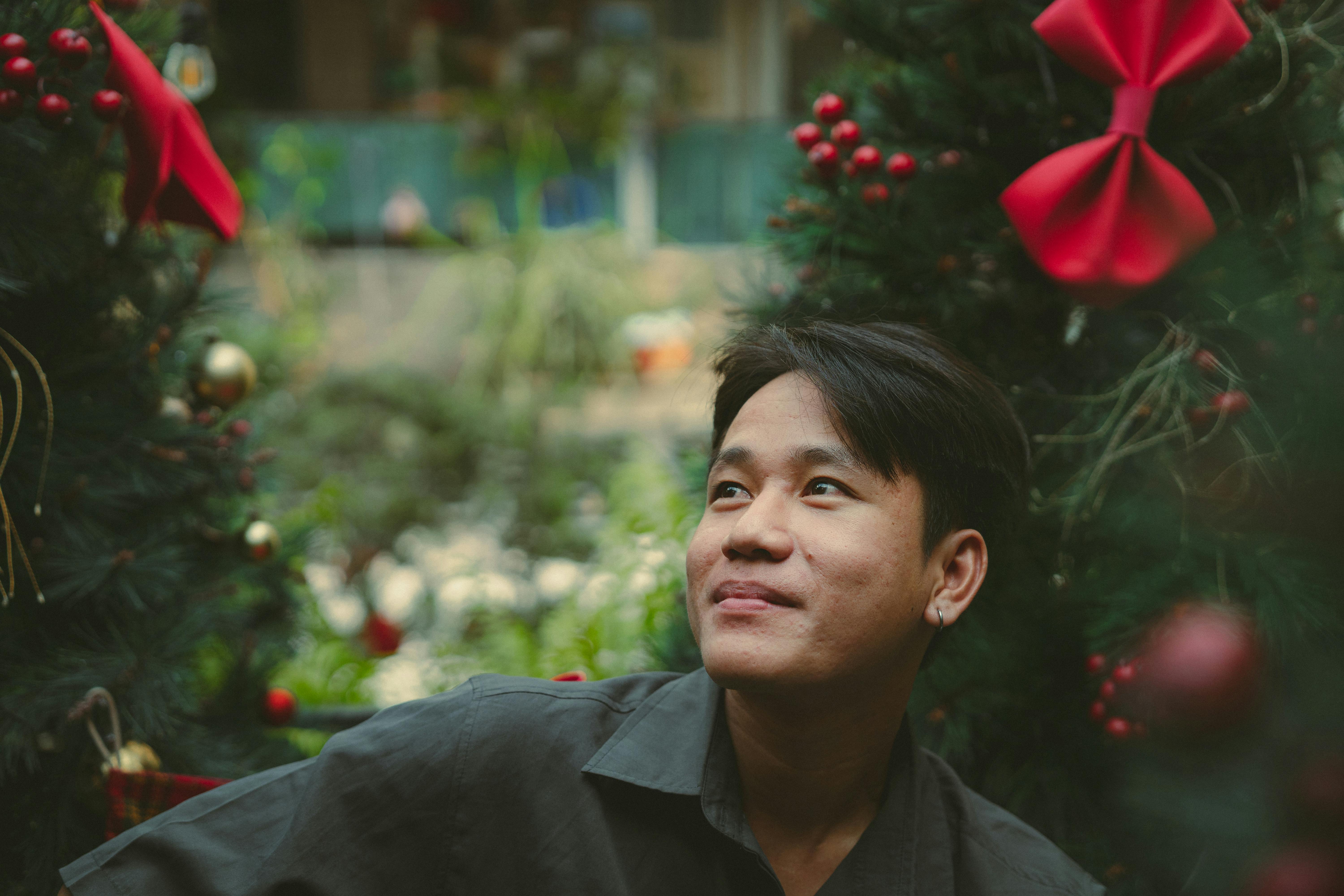 Festive Portrait Amidst Christmas Decorations · Free Stock Photo