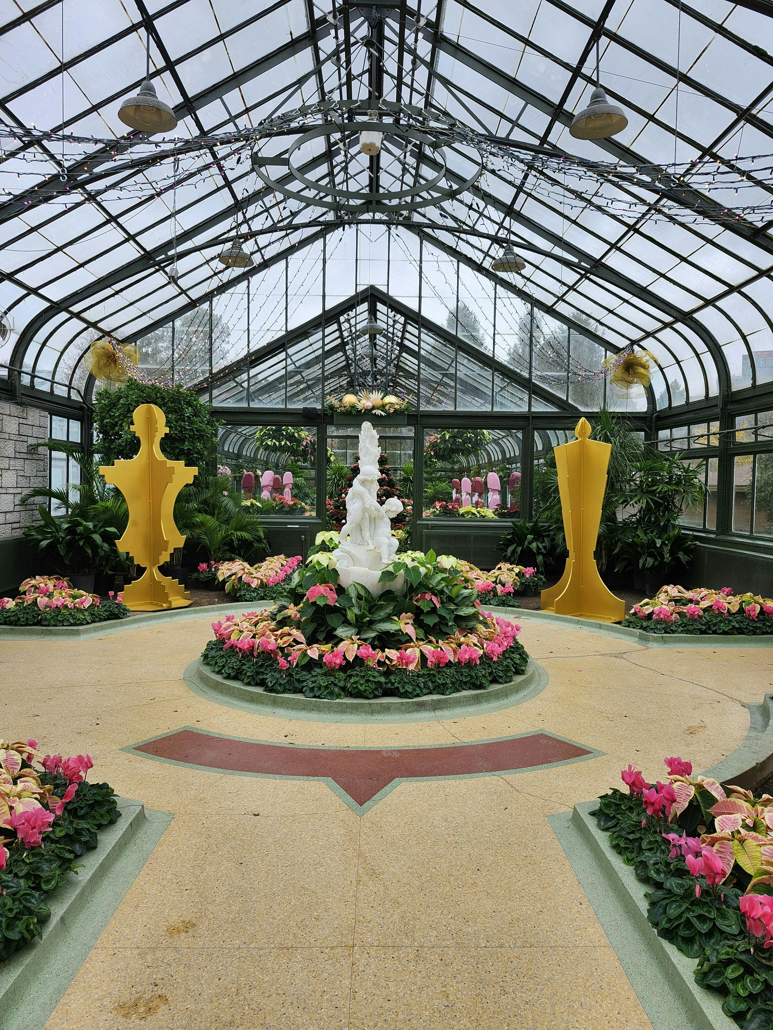 Elegant Greenhouse Interior with Floral Displays · Free Stock Photo