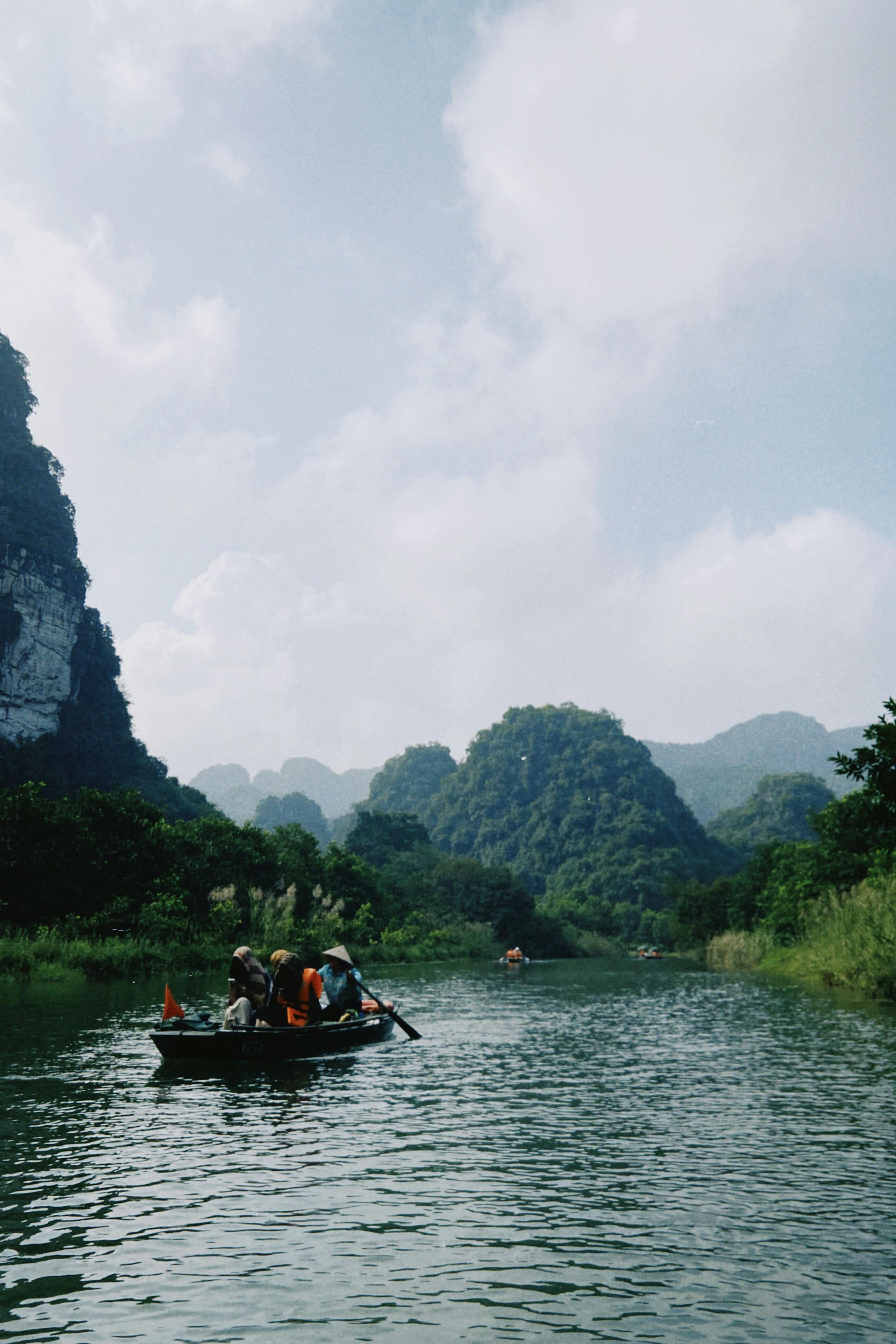 Serene River Boating in Scenic Landscape · Free Stock Photo
