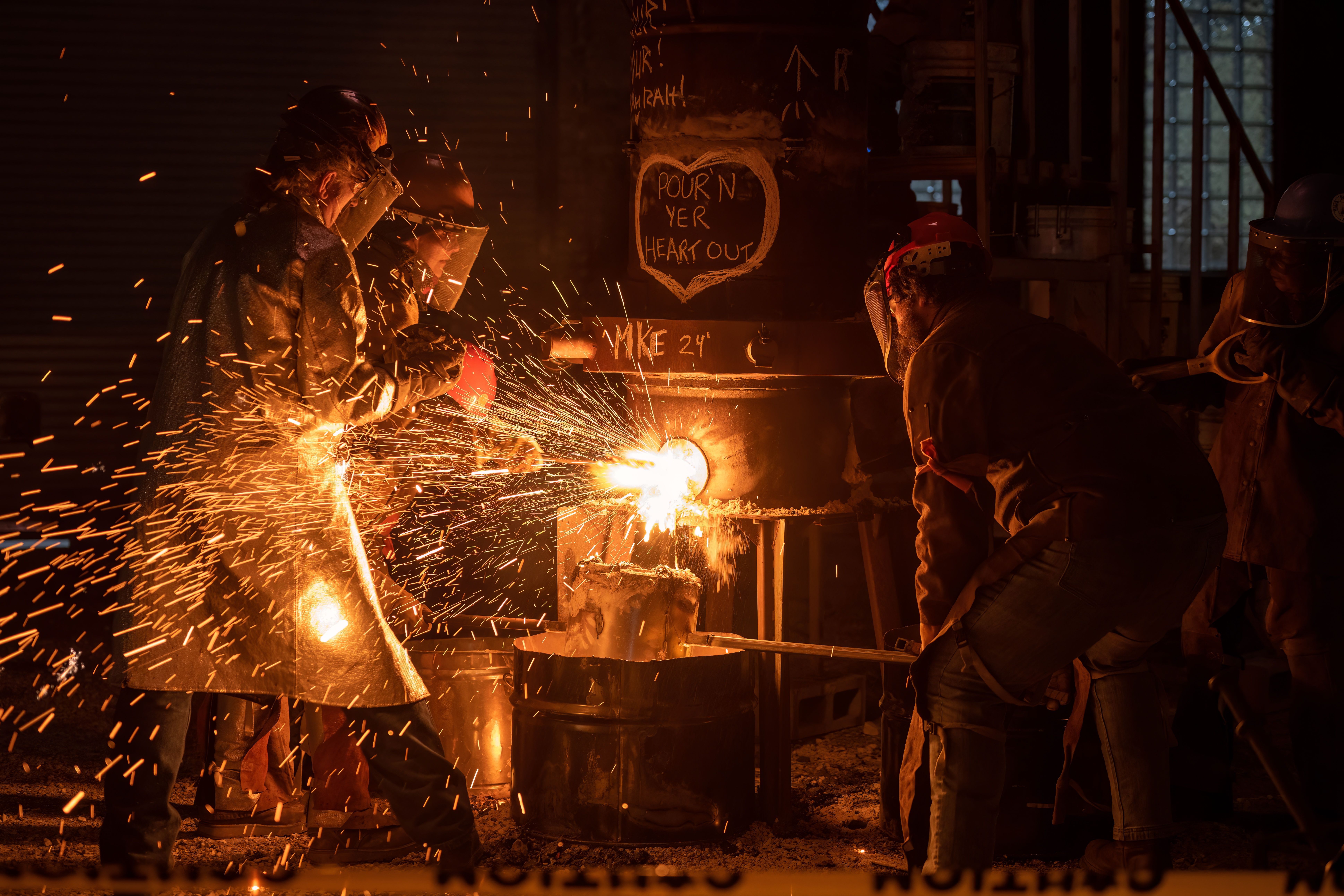 Man Lifting Hot Metal · Free Stock Photo