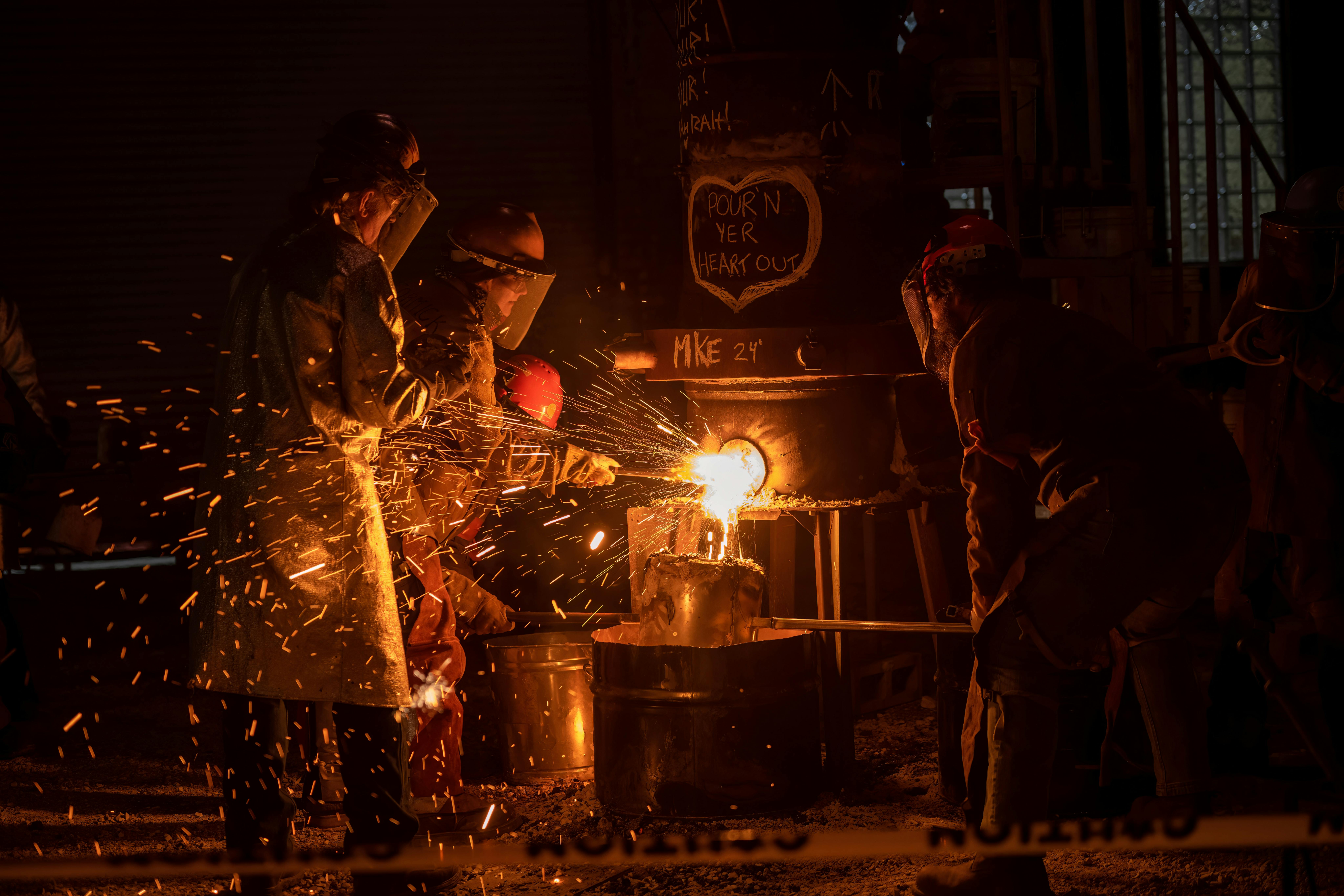 Industrial Foundry Workers in Milwaukee at Night · Free Stock Photo