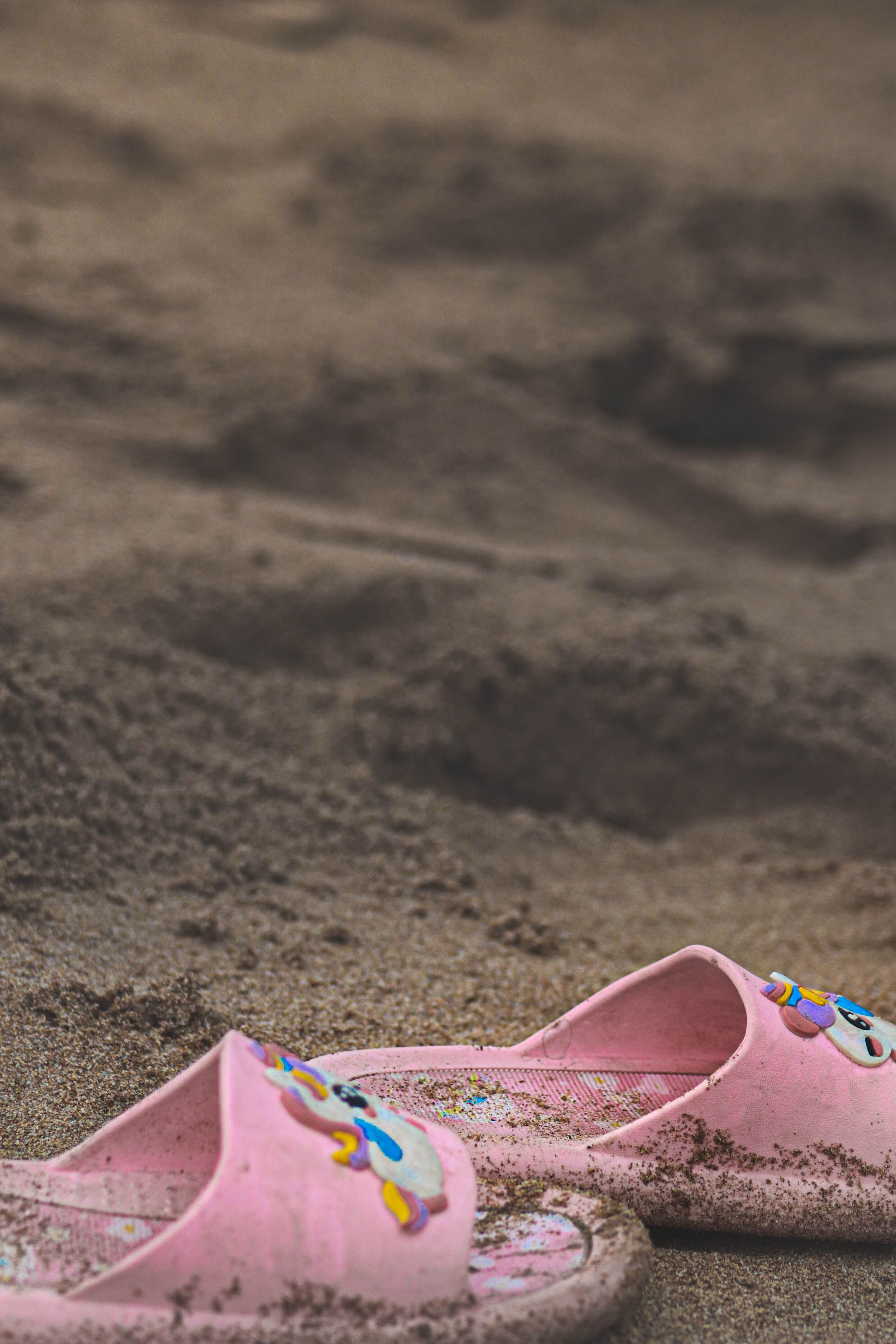 Pink Sandals on Sandy Beach Evoking Childhood Memories · Free Stock Photo