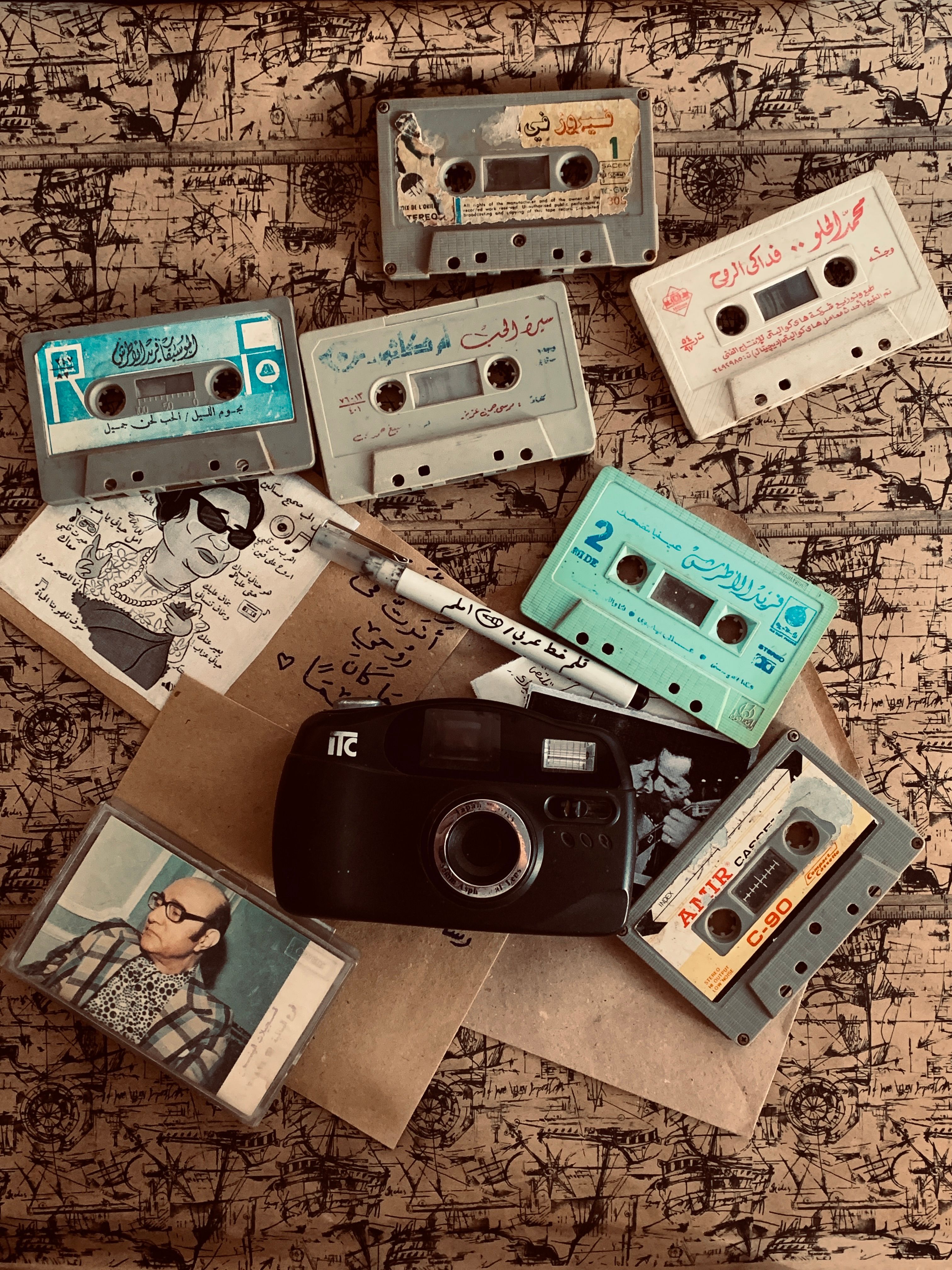 Vintage Cassette Tapes and Camera on Artistic Background · Free Stock Photo