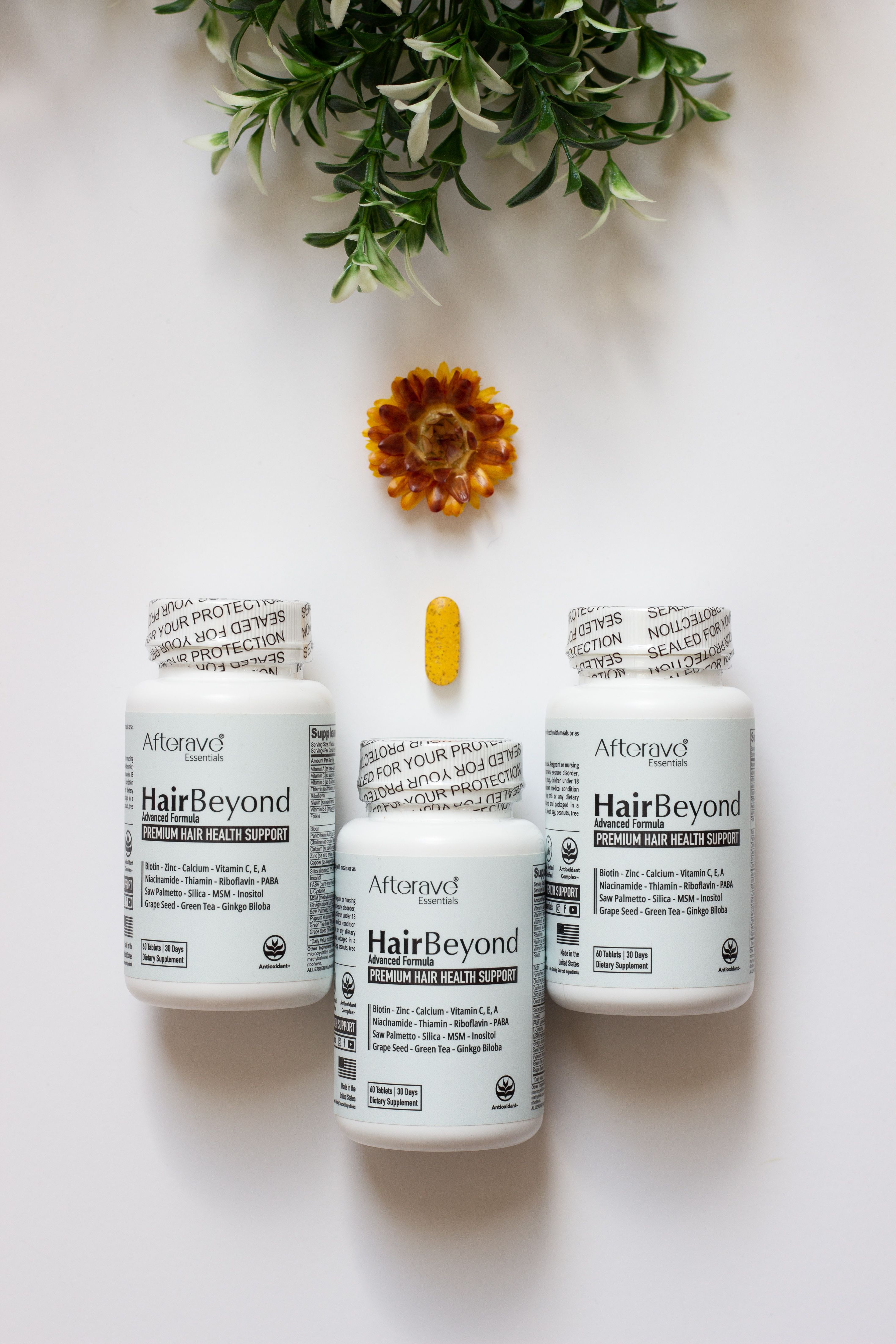 Hair Health Supplement Bottles on a Flat Lay · Free Stock Photo