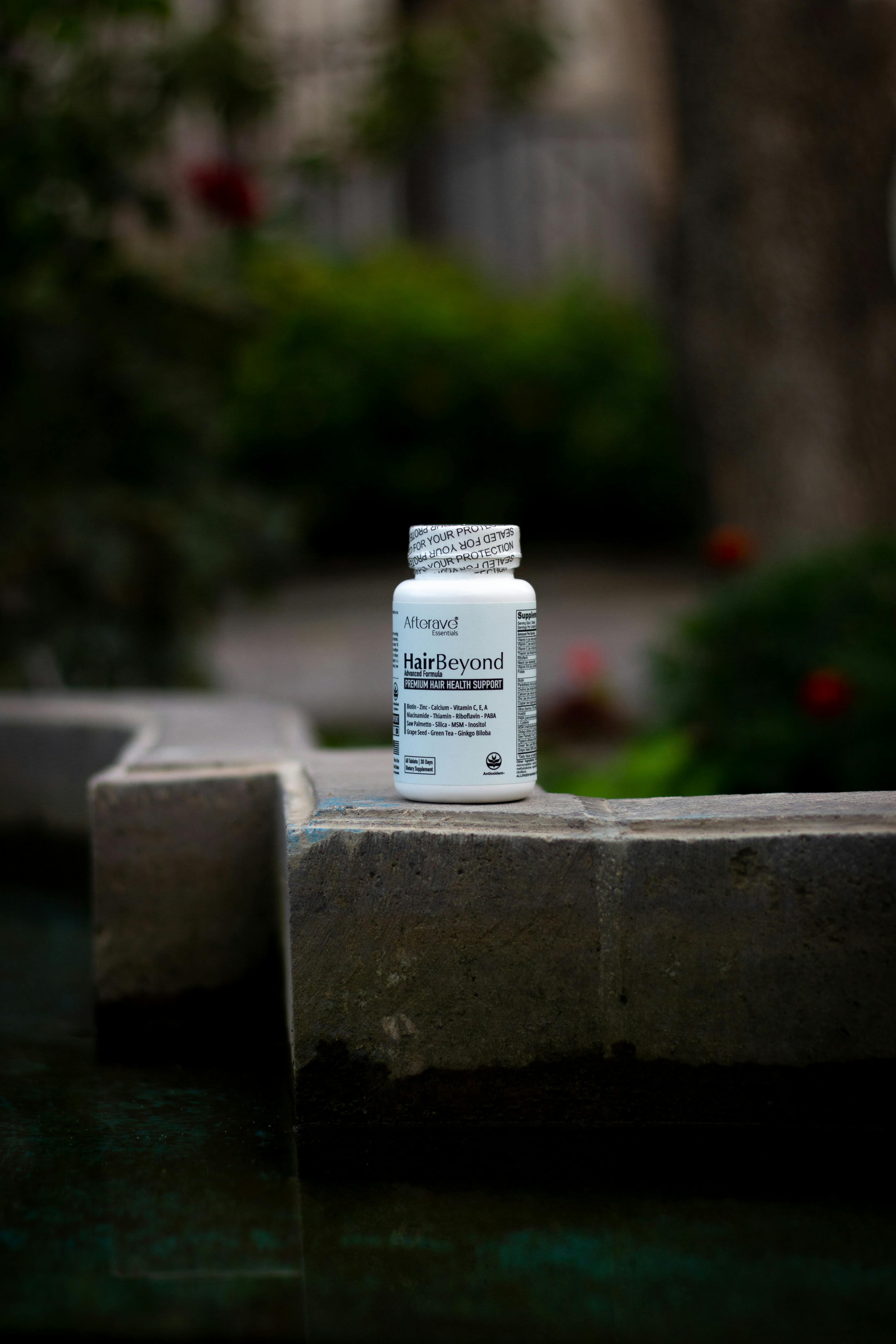 Afterave HairBeyond Supplement in Natural Setting · Free Stock Photo