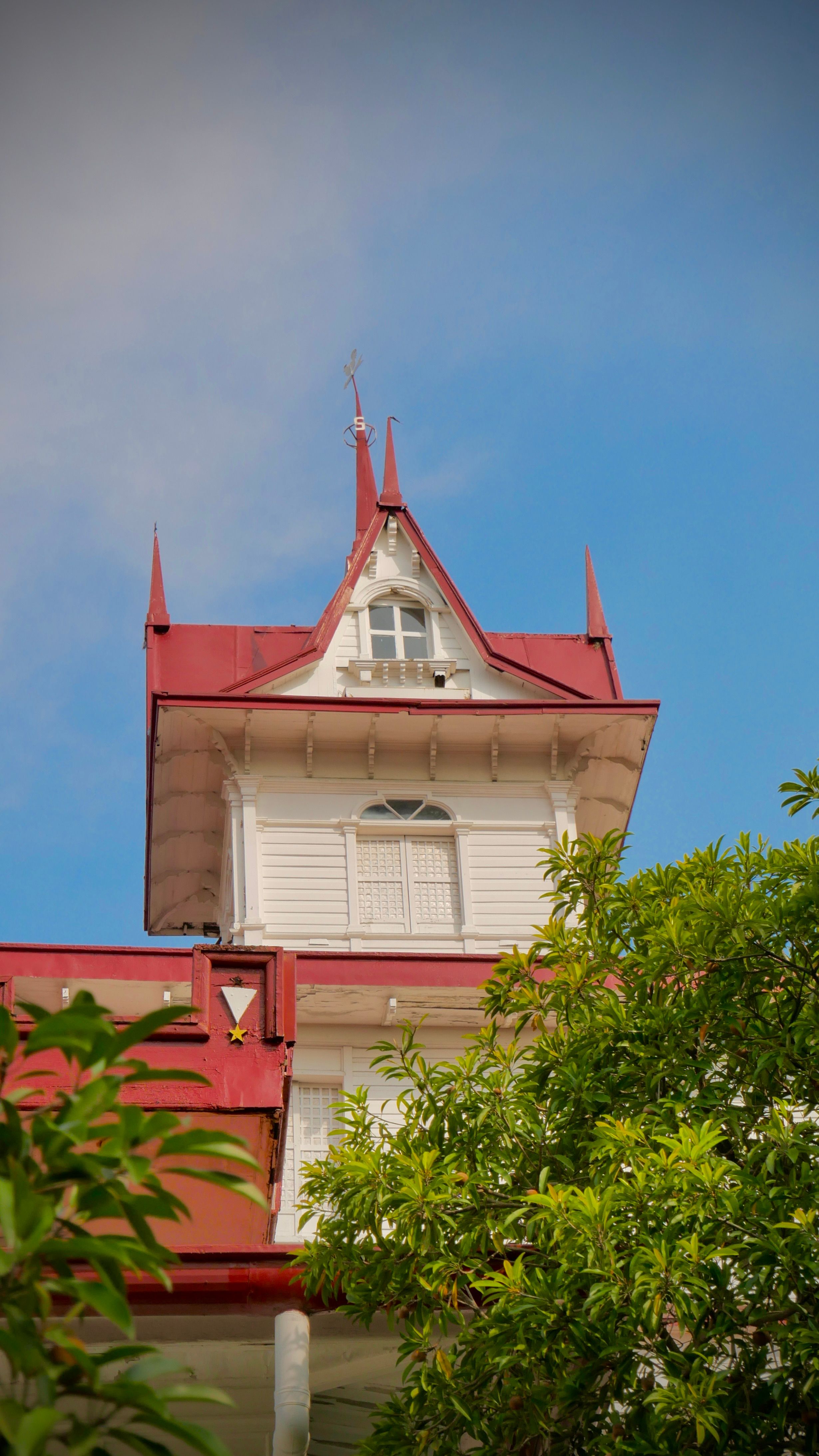 Victorian-Style House Tower Against Blue Sky · Free Stock Photo