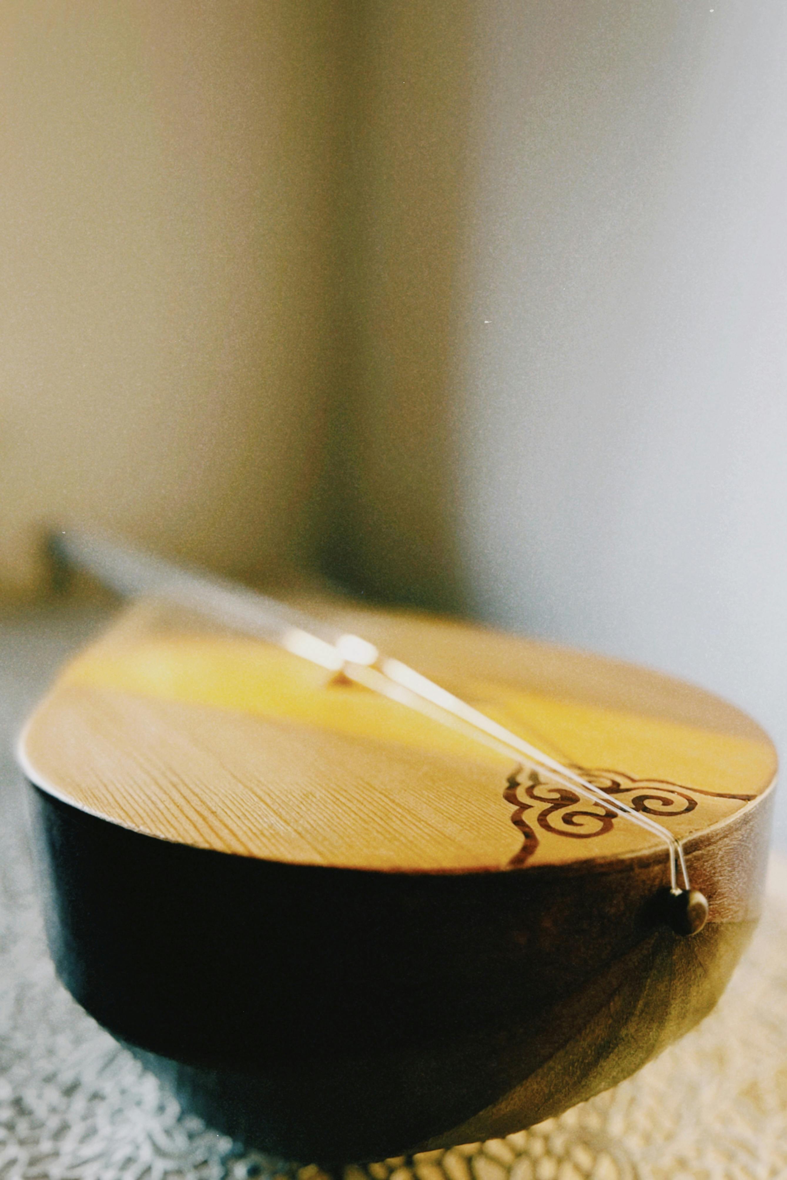 Traditional Dombyra on Wooden Surface · Free Stock Photo