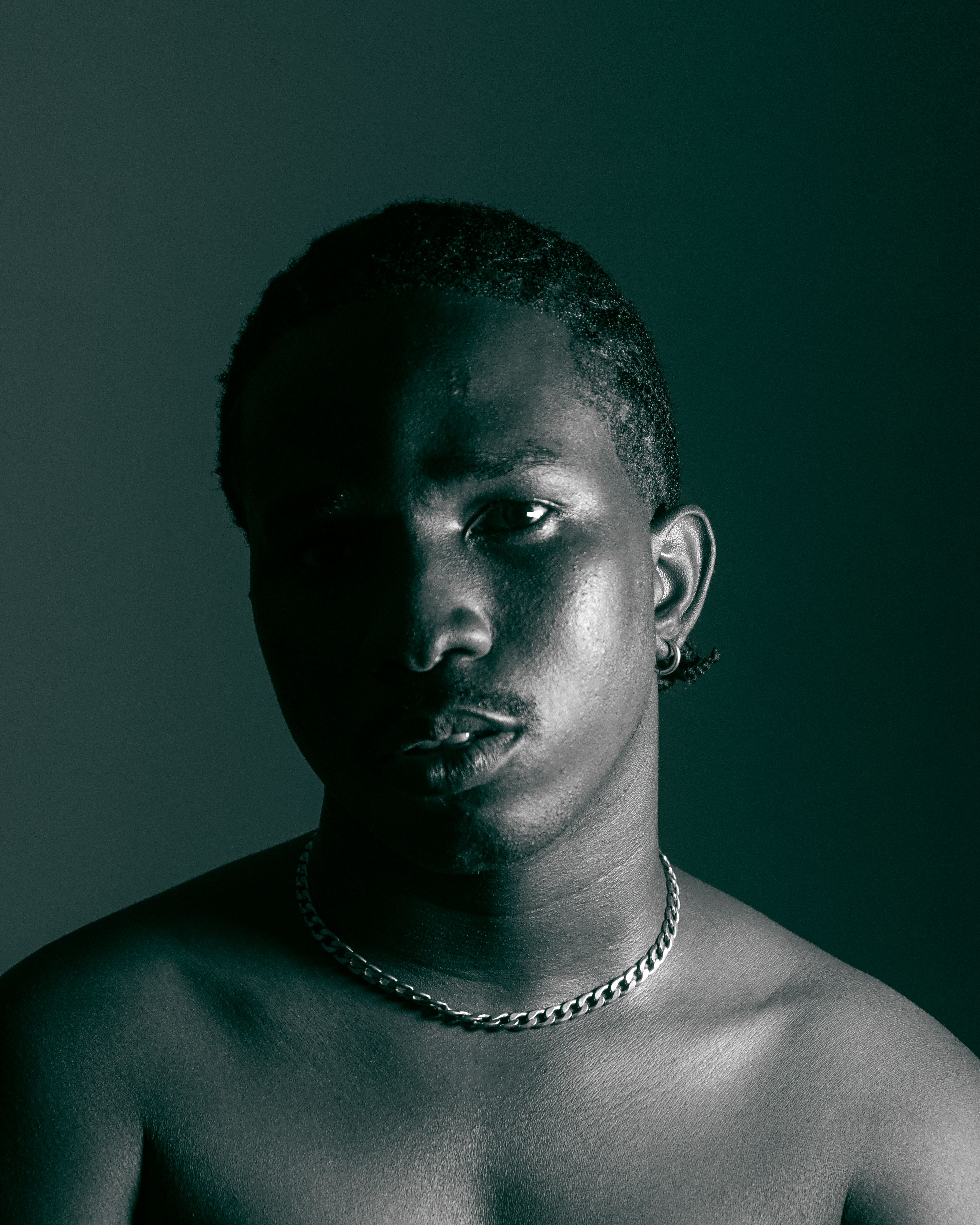 Moody Portrait of a Young Man in Shadow · Free Stock Photo
